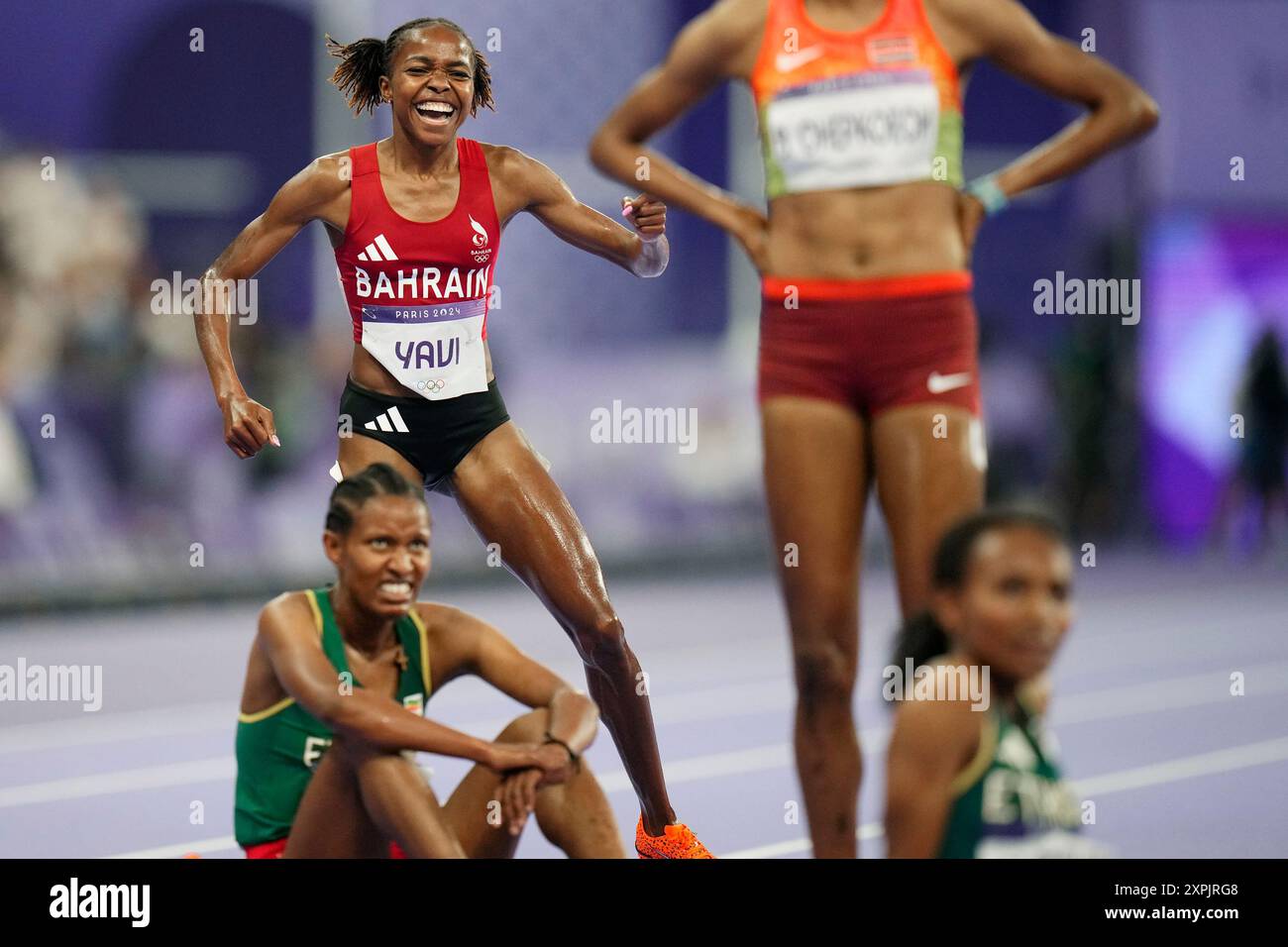 Winfred Yavi, of Bahrain, celebrates after winning the women's 3000 ...