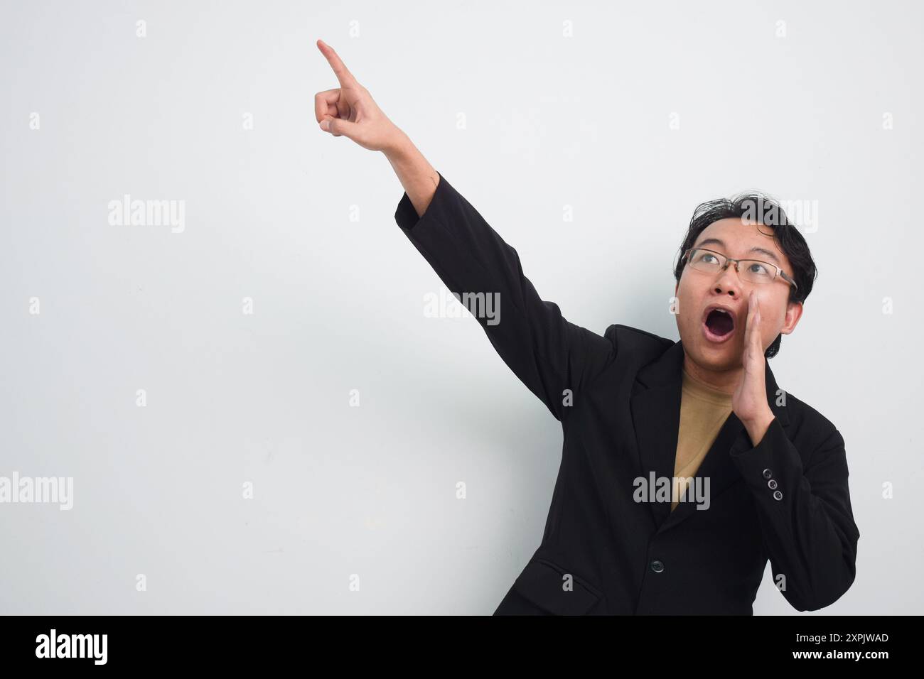 Asian Businessman yelling or shouting loud with pointing product in ...