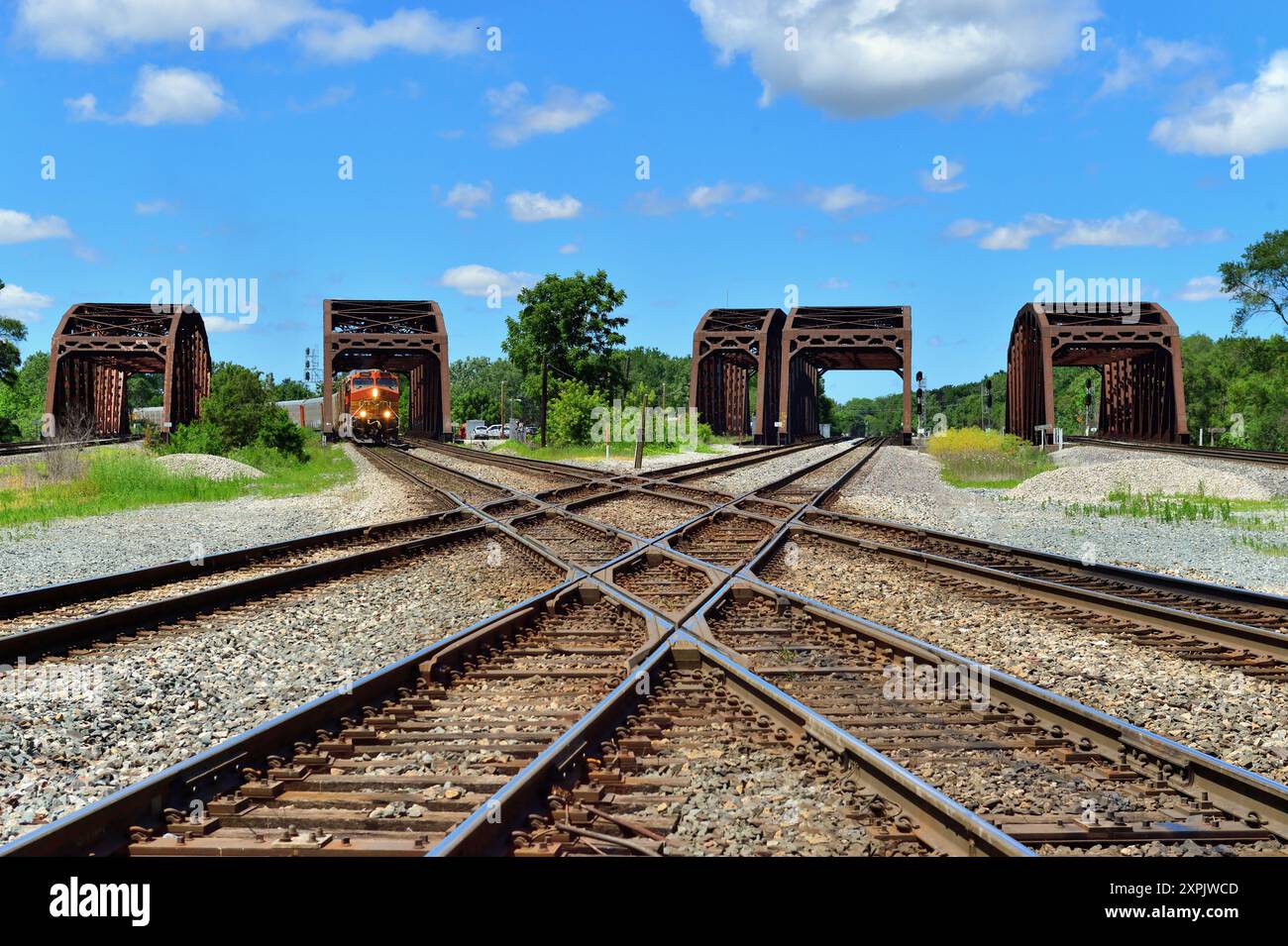Blue Island, Illinois, USA. A Burlington Northern Santa Fe locomotive leads an auto rack freight ...