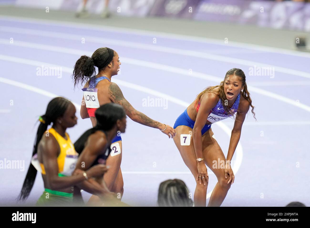 Gabrielle Thomas, of the United States, right, reacts after winning the ...