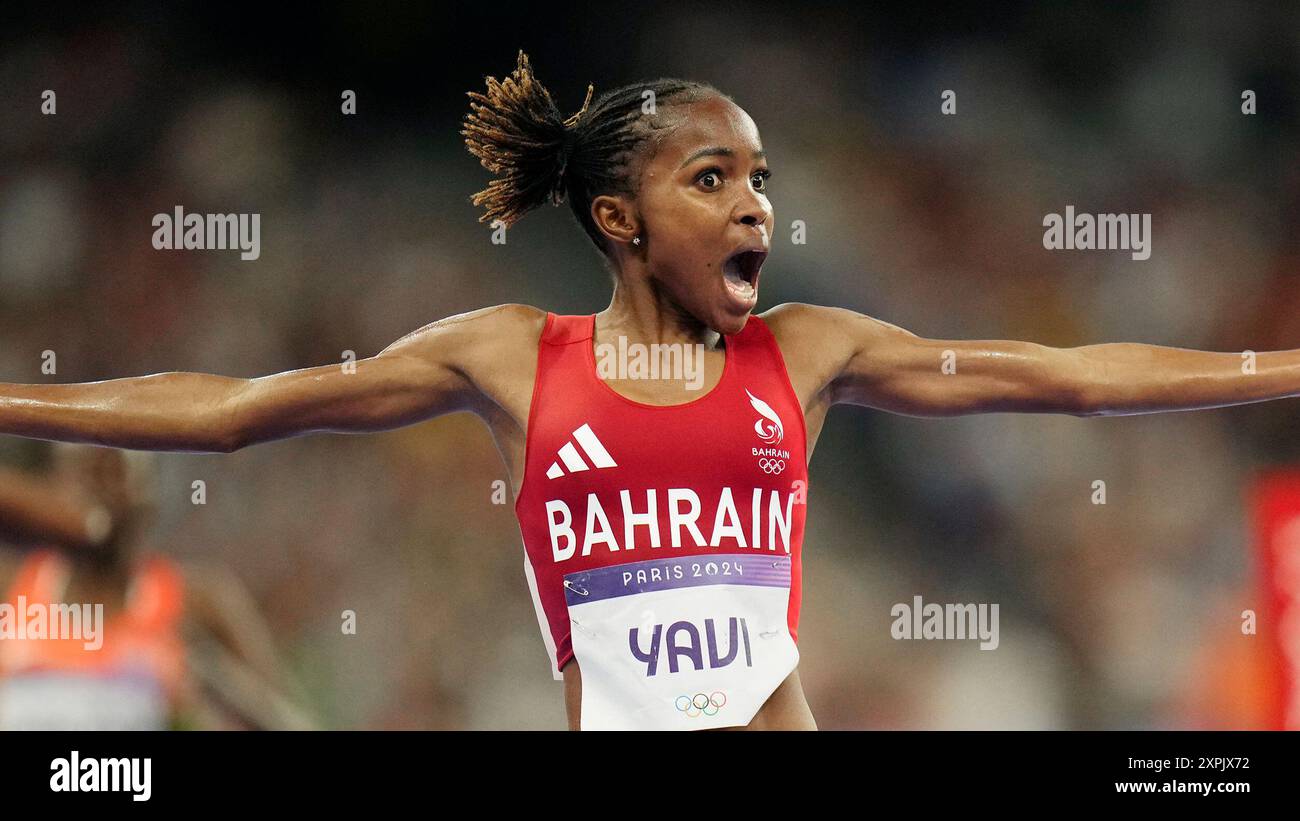 Winfred Yavi, of Bahrain, celebrates after winning the women's 3000 ...