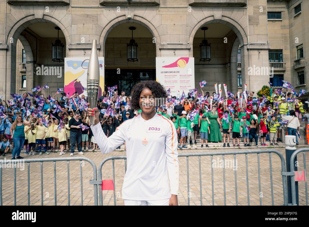 Nsimba Makonda M Buta, holding the flame in front of Montreuil Town ...