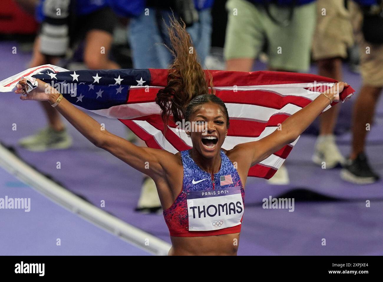 Gabrielle Thomas, of the United States, celebrates her win in the women ...