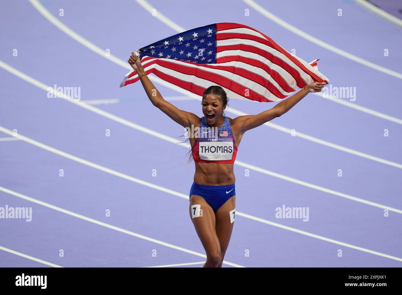 Gabrielle Thomas, of the United States, celebrates her win in the women ...