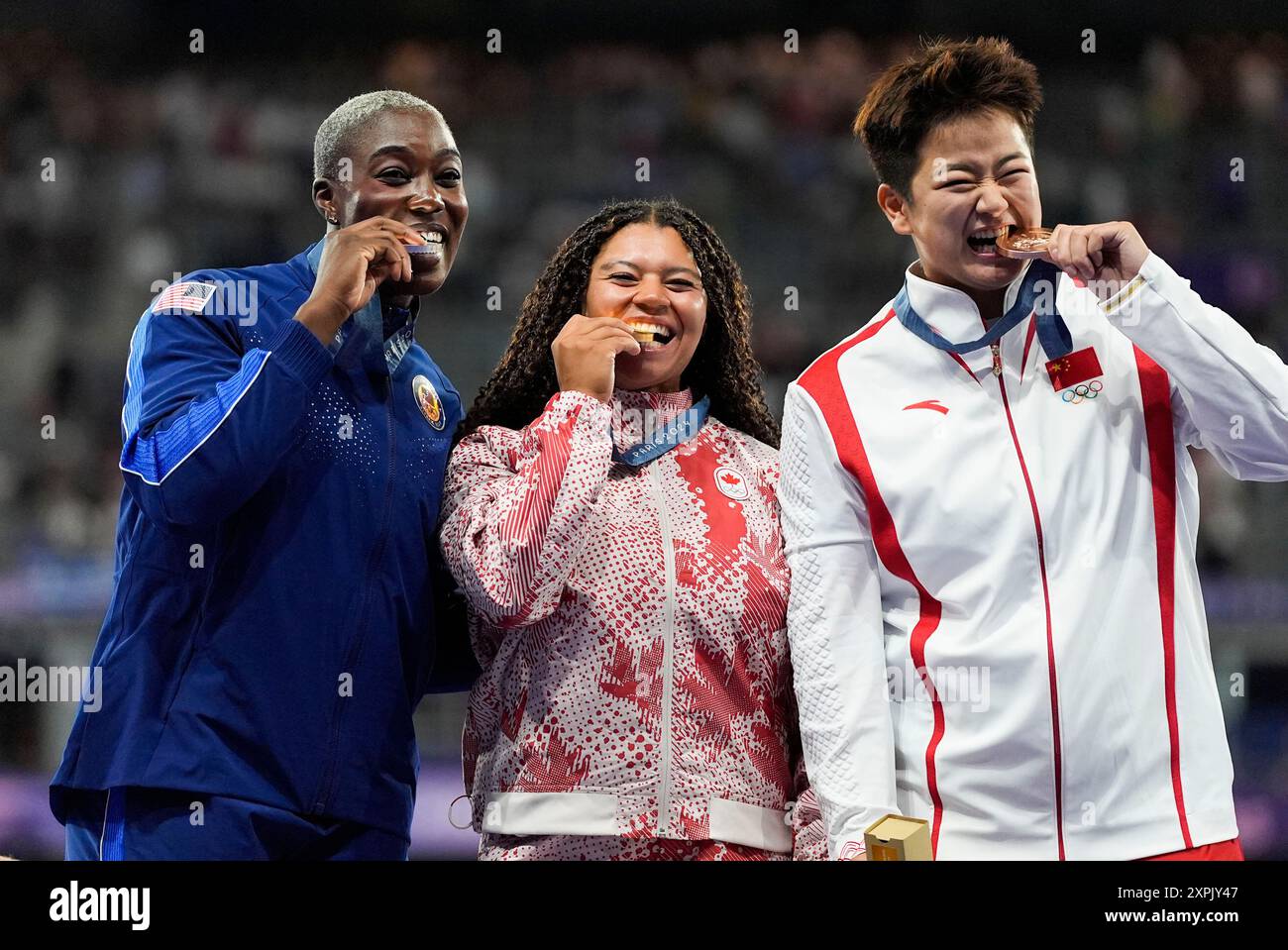 Gold medalist, Camryn Rogers, of Canada, stands with silver medalist ...