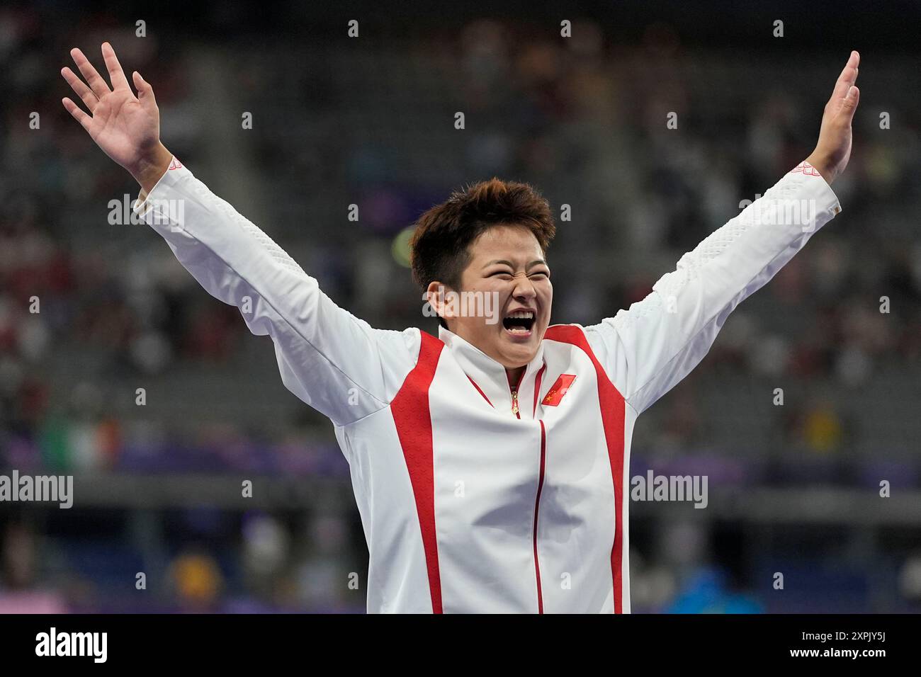 Bronze medalist Zhao Jie, of China, stands on the podium after the ...
