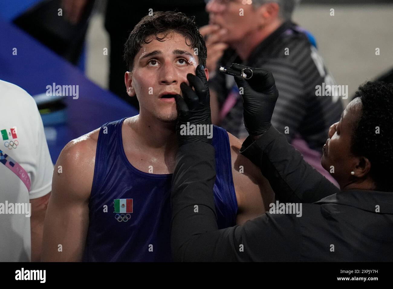 Mexico's Marco Verde gets checked after fighting Britain's Lewis ...
