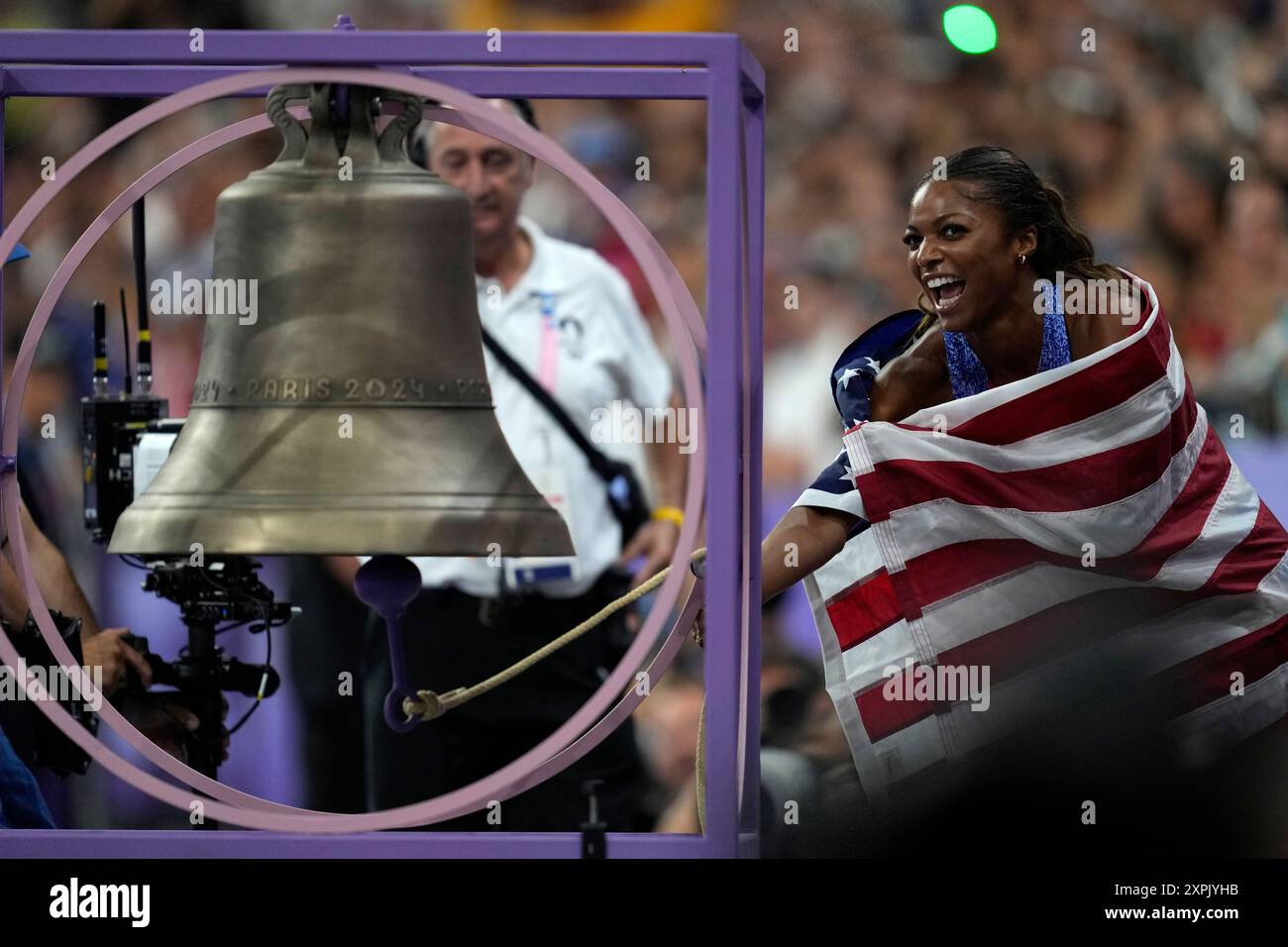 Gabrielle Thomas, of the United States, rings the bell after winning ...