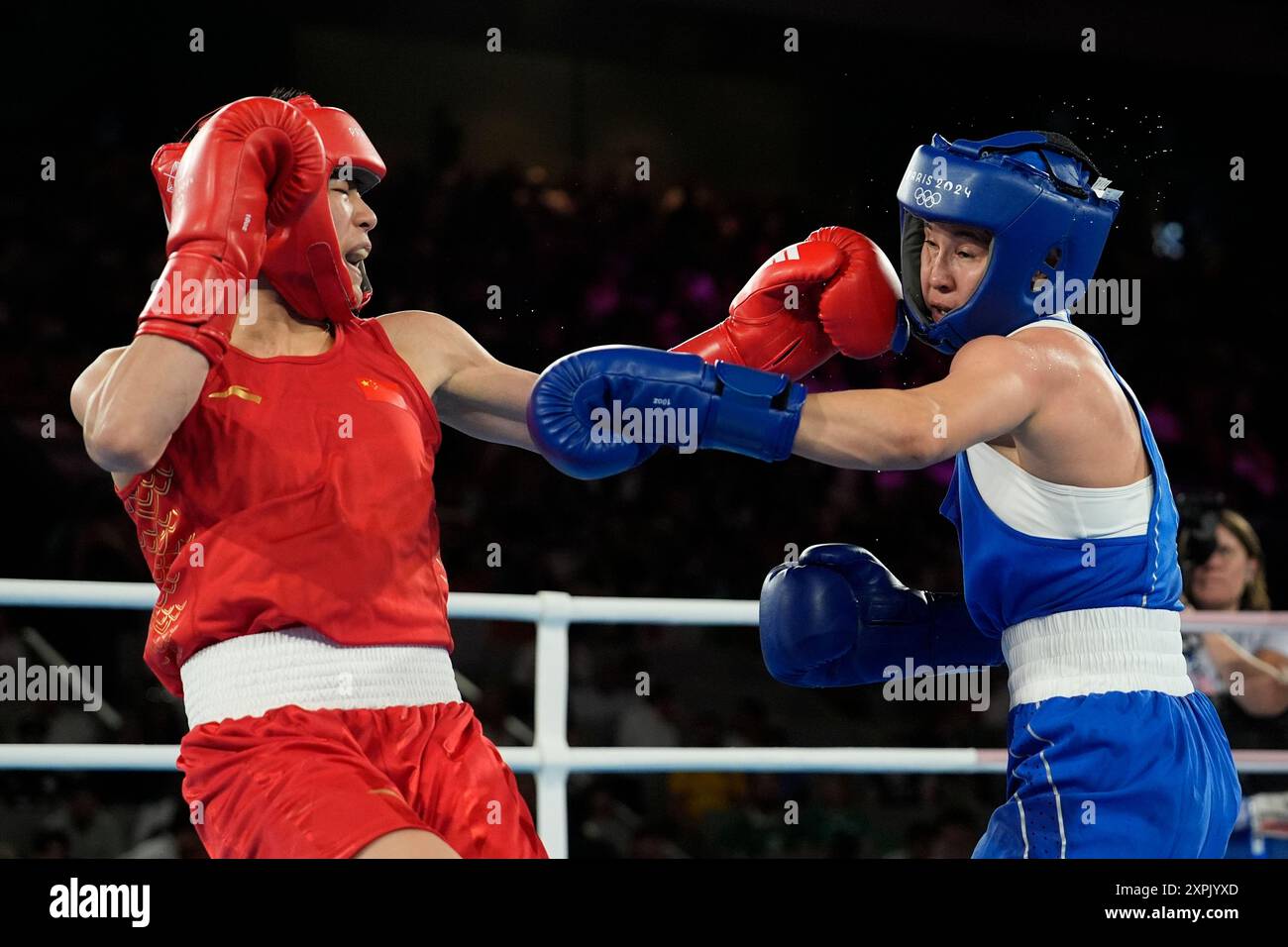 China's Wu Yu, left, fights Kazakhstan's Nazym Kyzaibay in their women ...