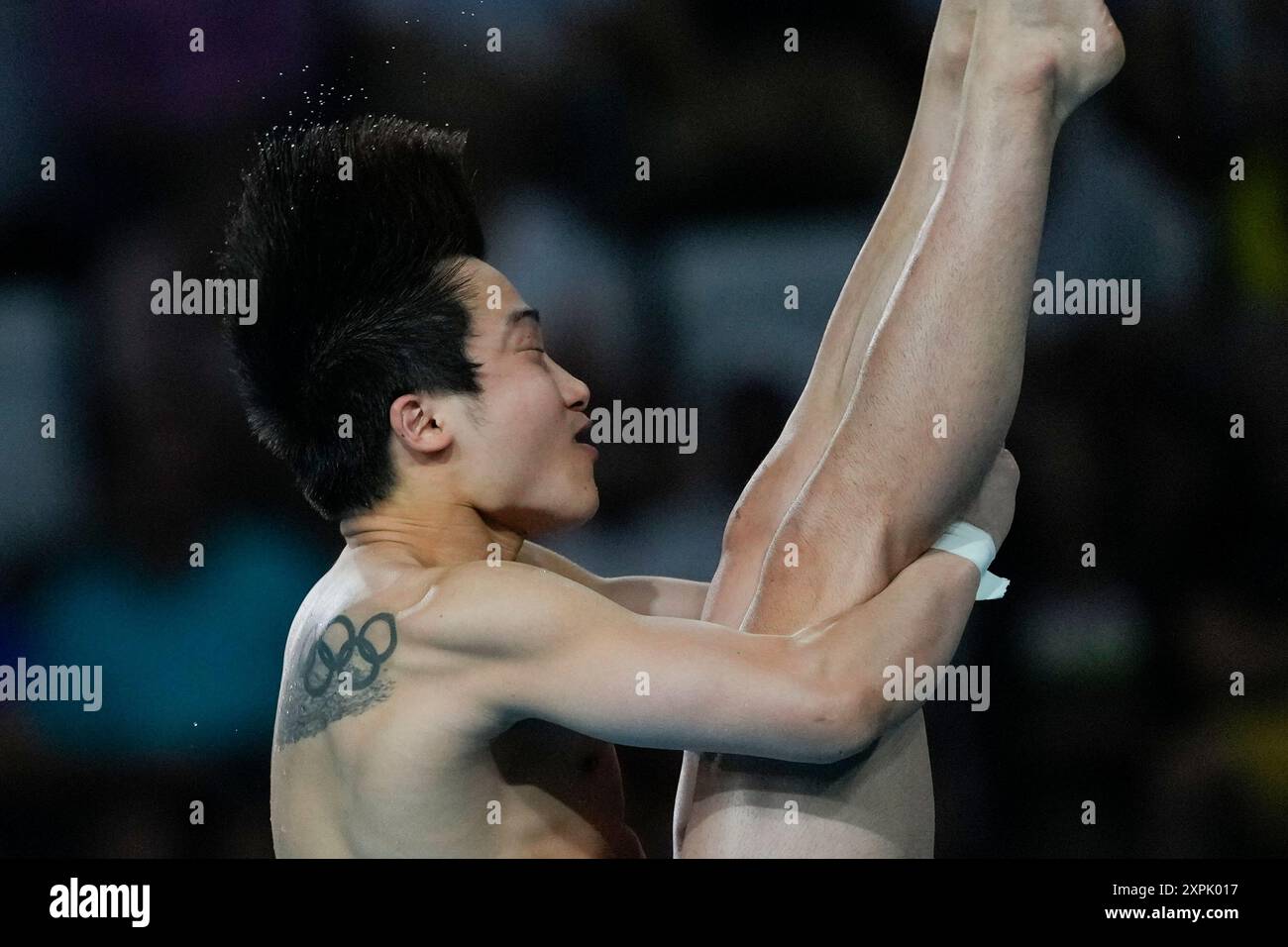 South Korea's Woo Ha-ram competes in the men's 3m springboard diving ...