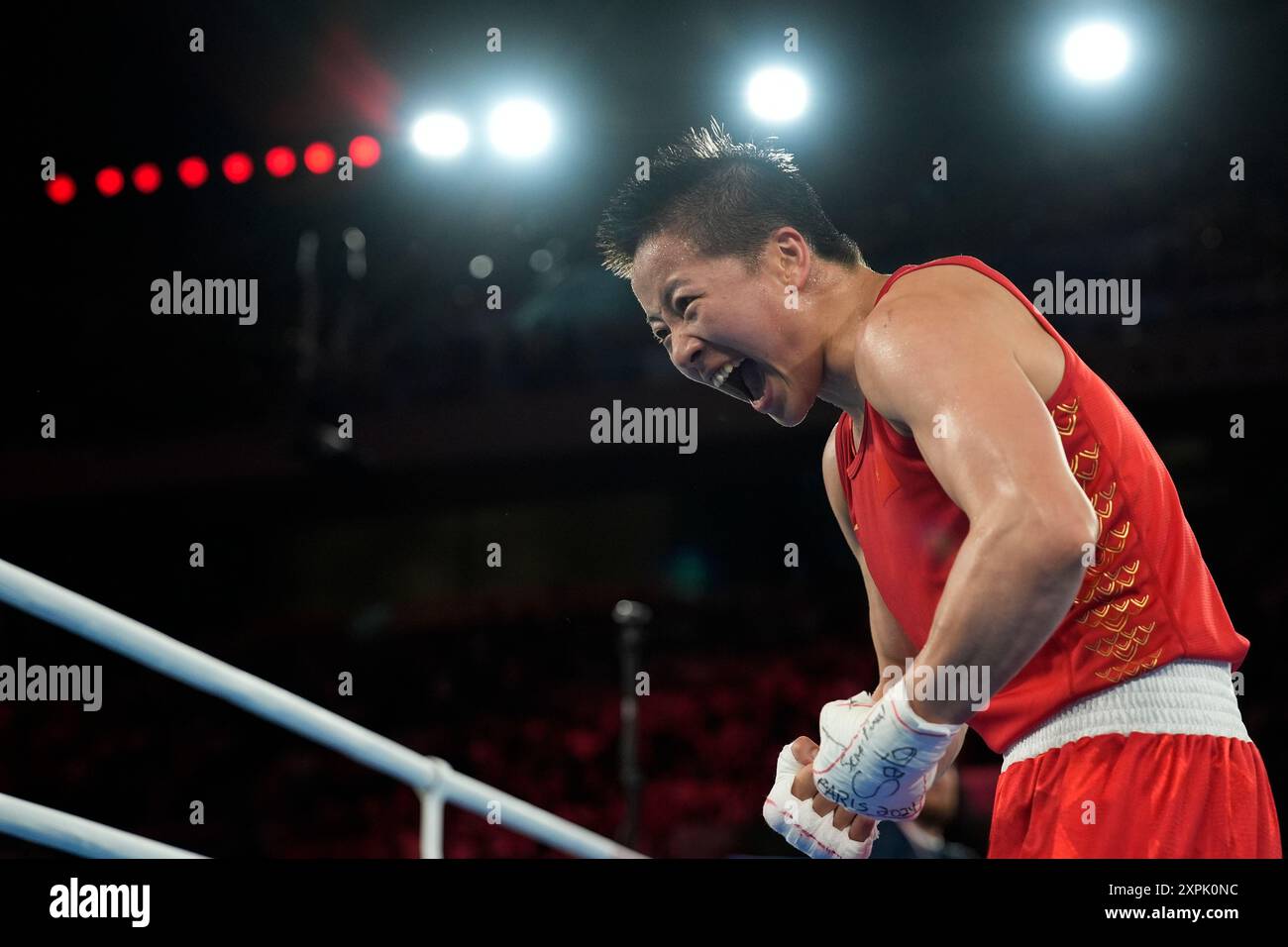 China's Wu Yu celebrates after defeating Kazakhstan's Nazym Kyzaibay in ...