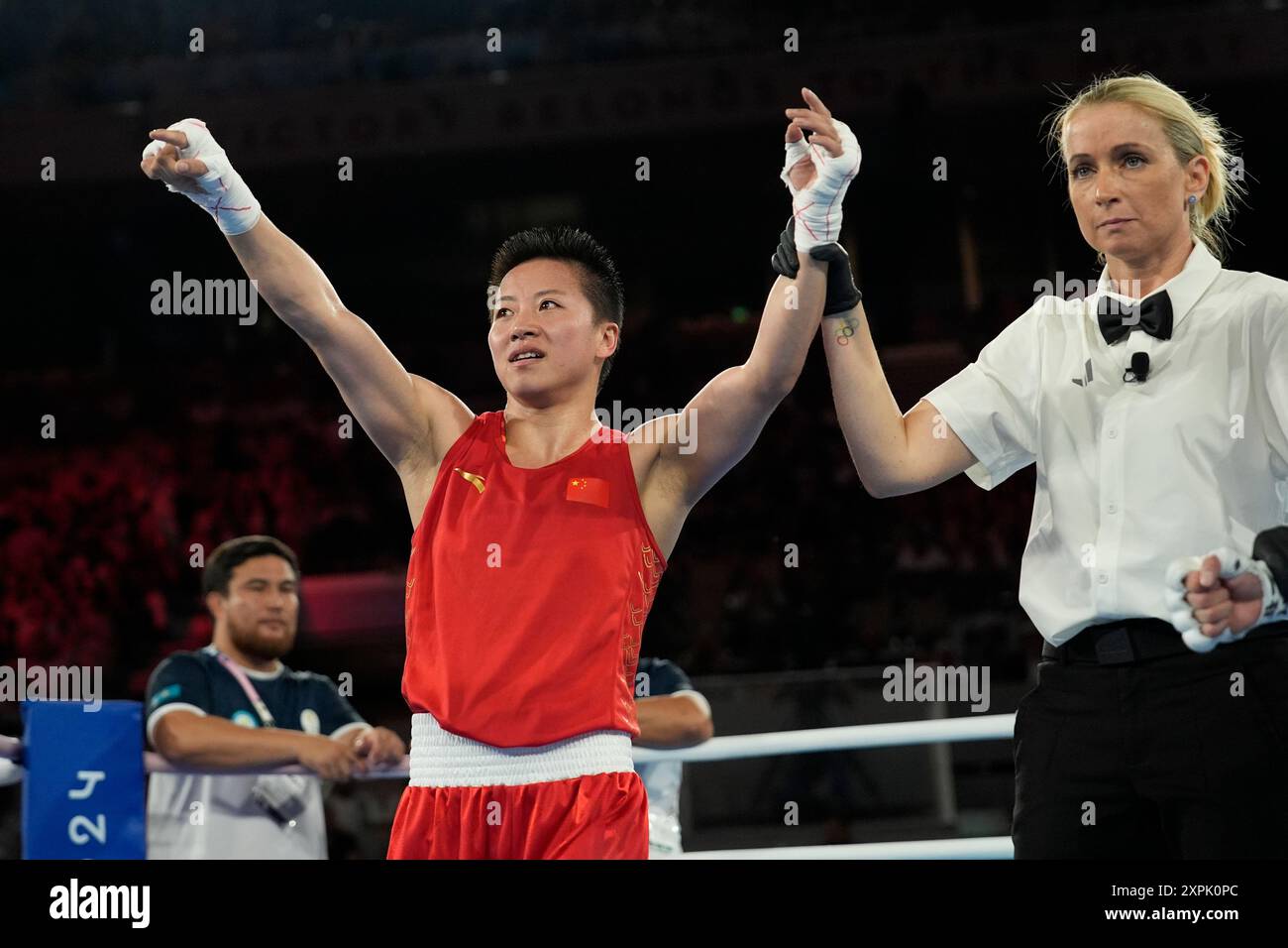 China's Wu Yu celebrates after defeating Kazakhstan's Nazym Kyzaibay in ...