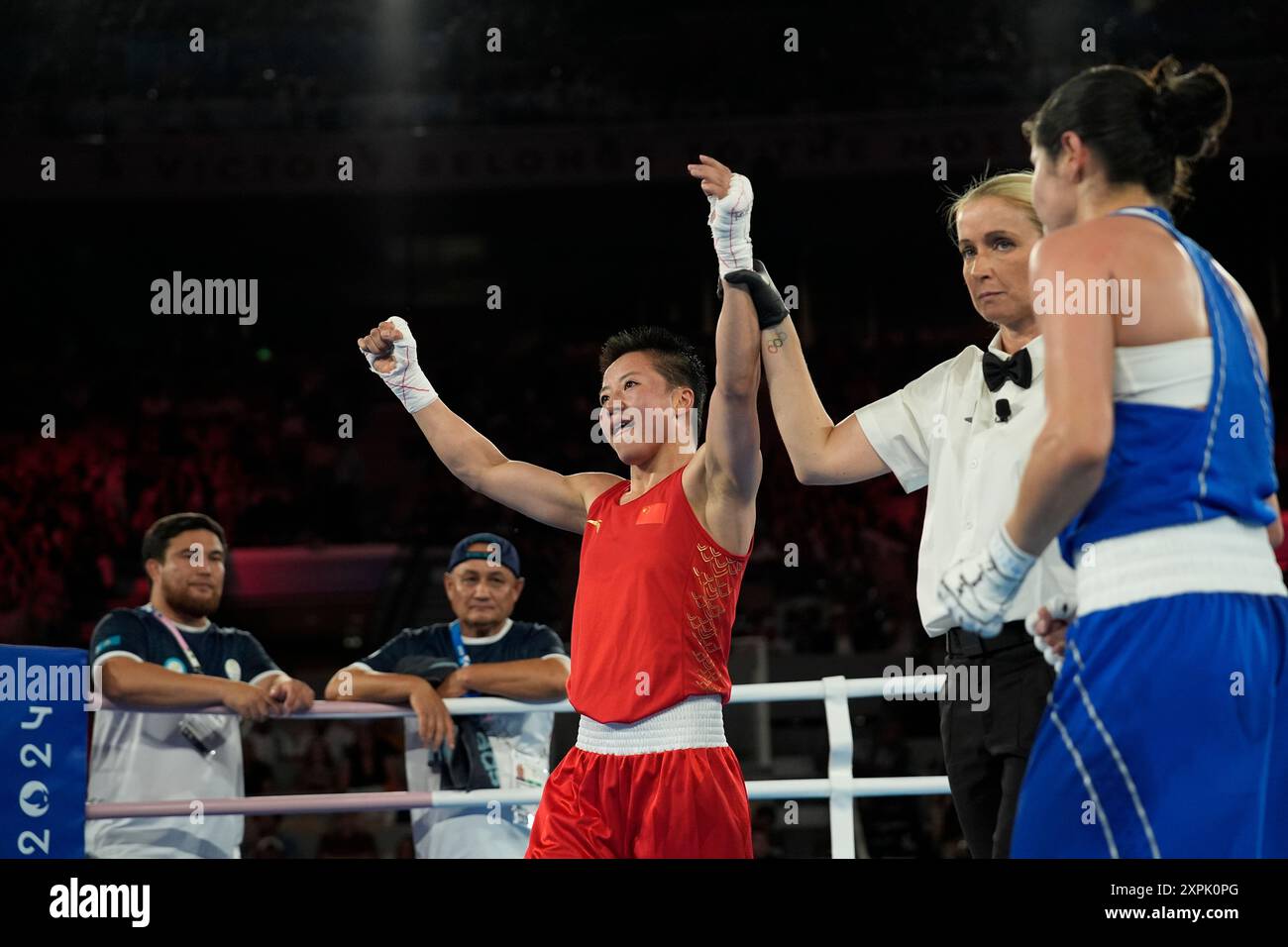 China's Wu Yu celebrates after defeating Kazakhstan's Nazym Kyzaibay in ...