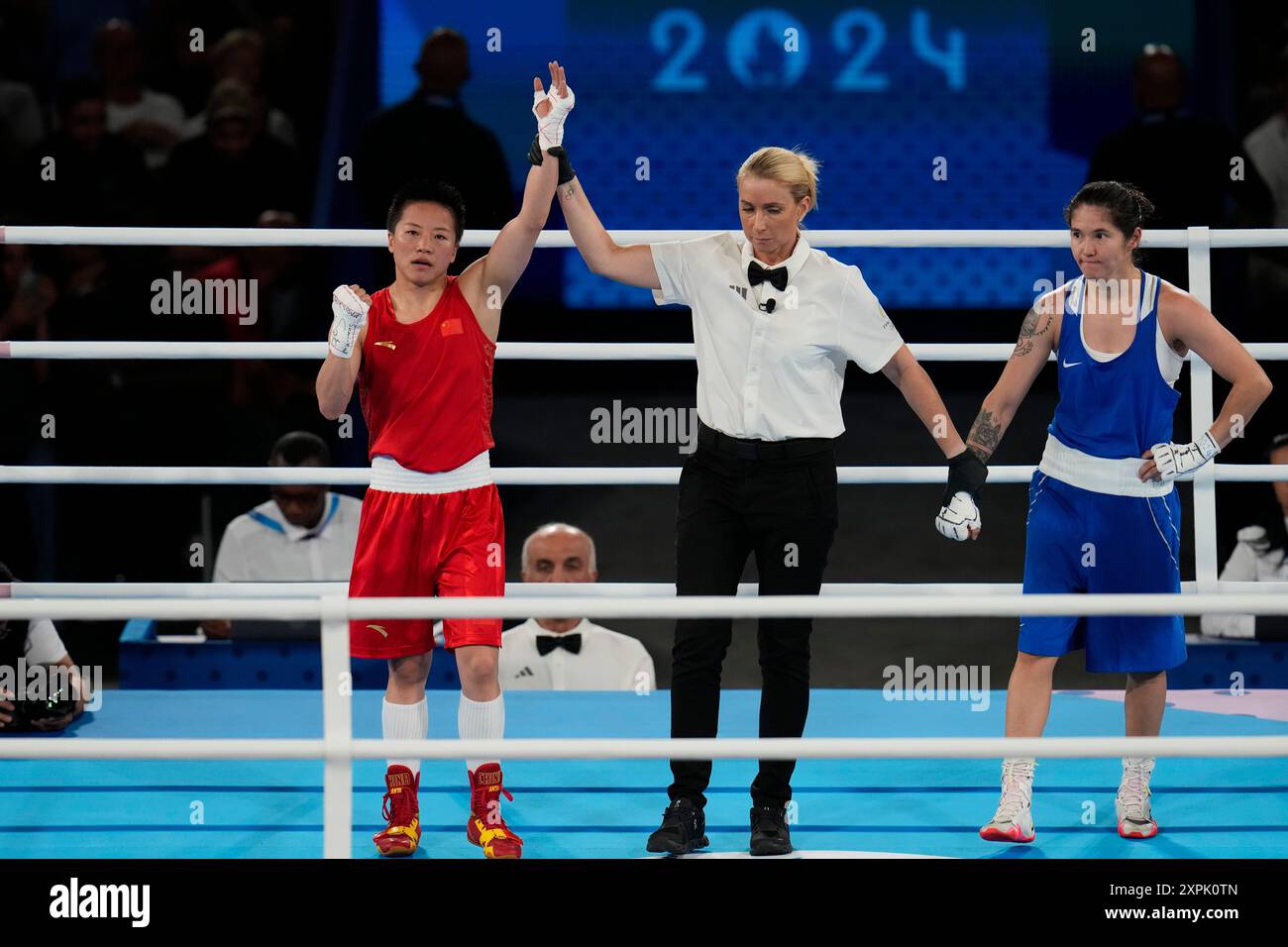 China's Wu Yu celebrates after defeating Kazakhstan's Nazym Kyzaibay ...