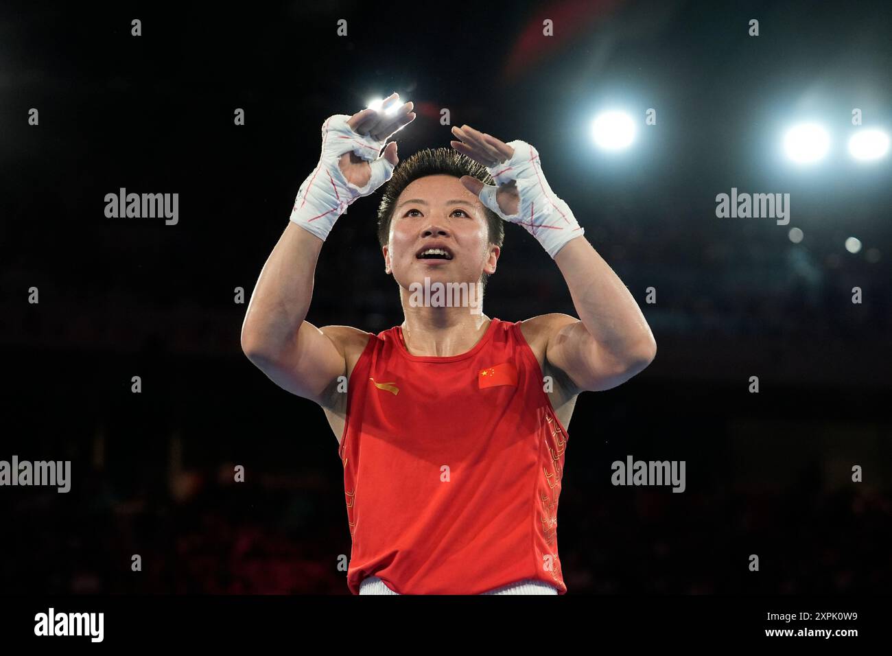 China's Wu Yu celebrates after defeating Kazakhstan's Nazym Kyzaibay in ...