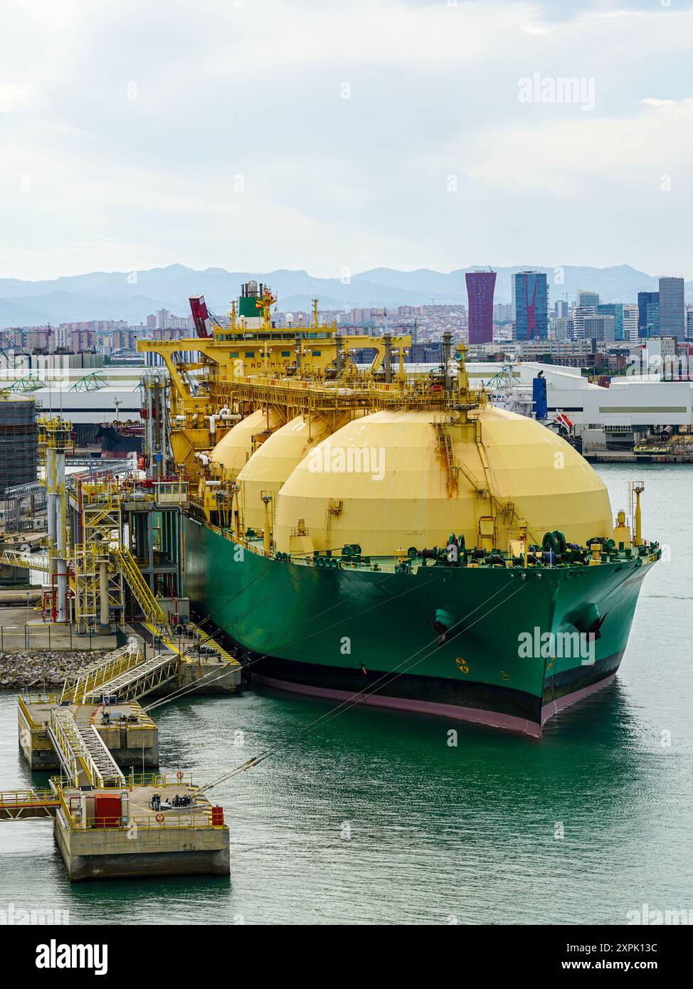 Large LNG tanker unloading at Barcelona port gas terminal, liquefied natural gas tanker ...