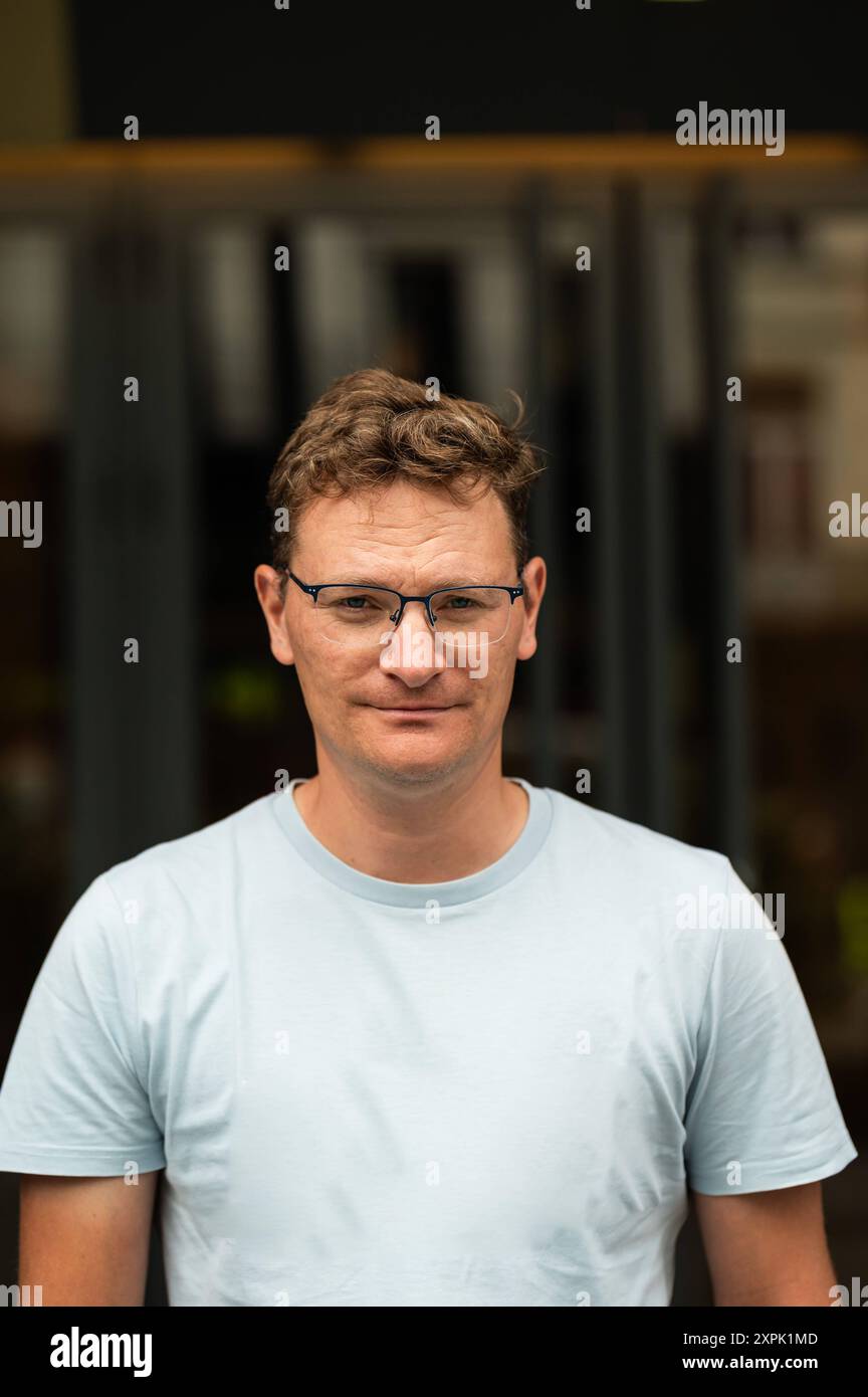 Portrait of a 45 yo white man with a city background, Brussels, Belgium ...