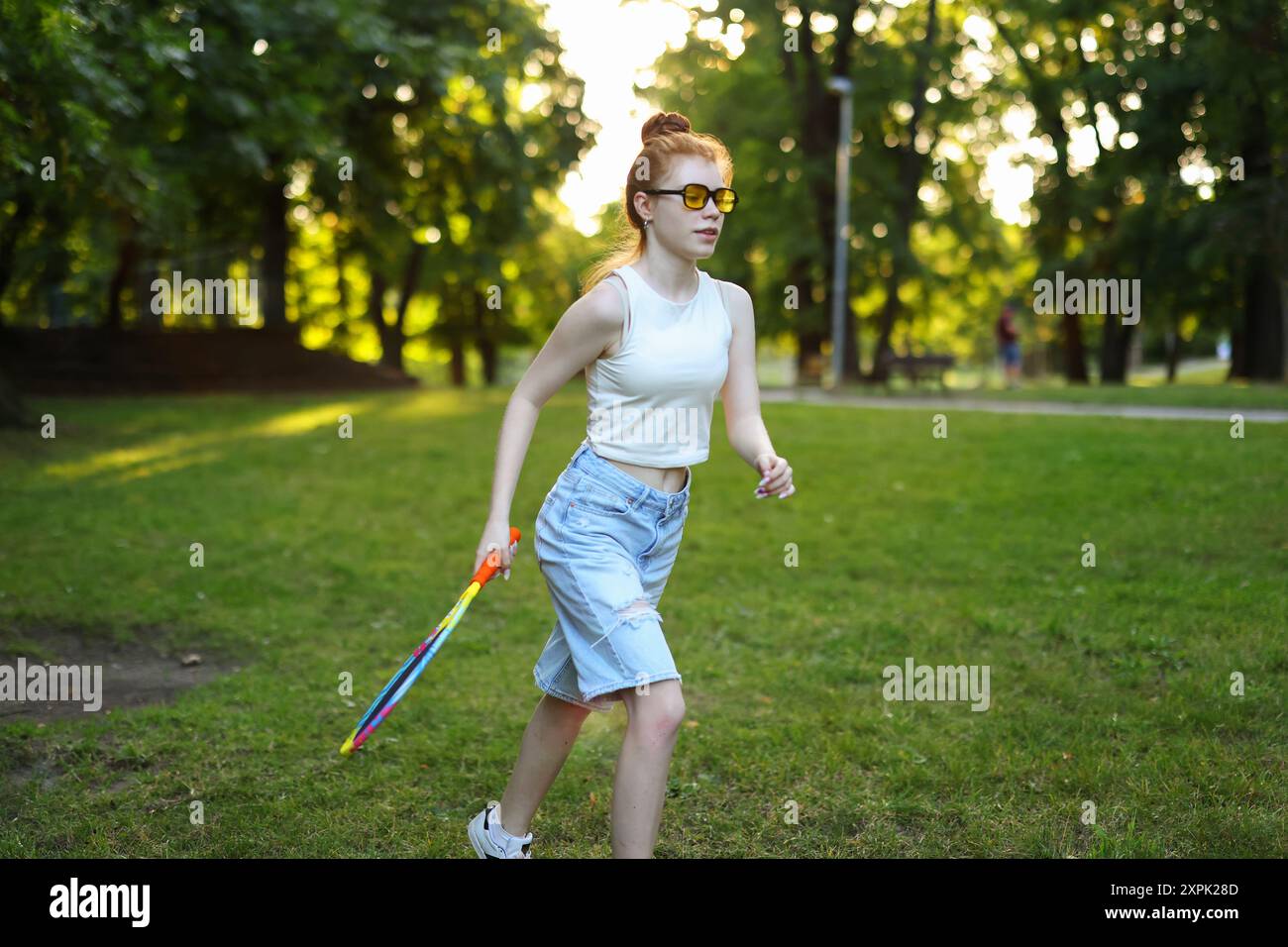 Girl playing badminton in park hi-res stock photography and images - Alamy
