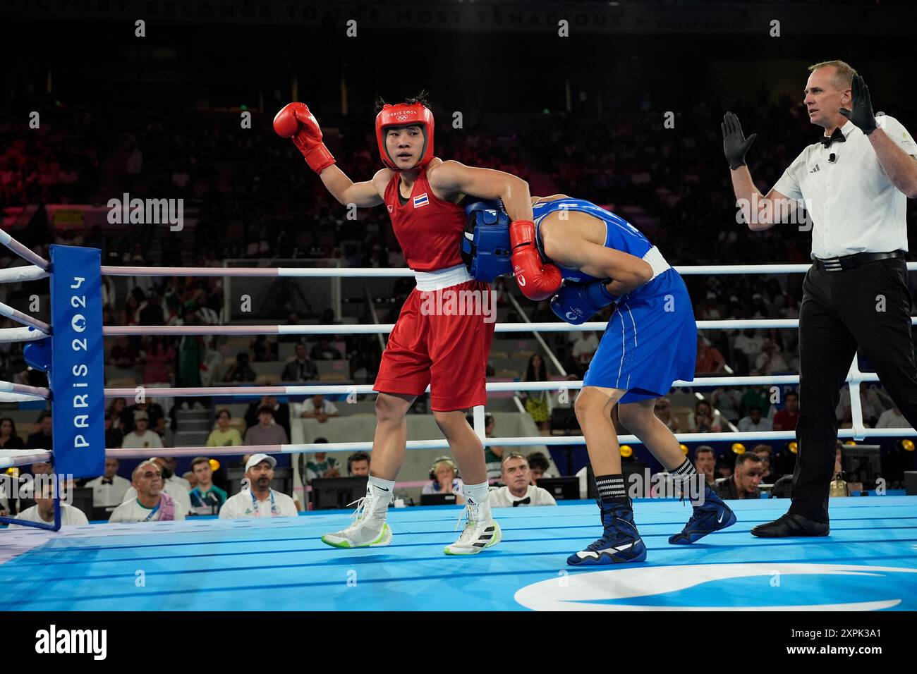 Thailand's Janjaem Suwannapheng, left, fights Algeria's Imane Khelif in ...