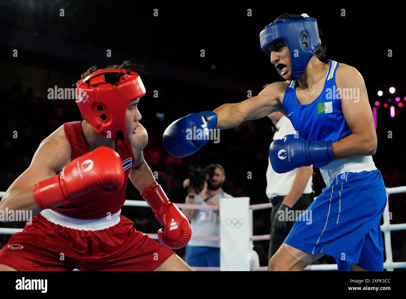Thailand's Janjaem Suwannapheng, left, fights Algeria's Imane Khelif in ...