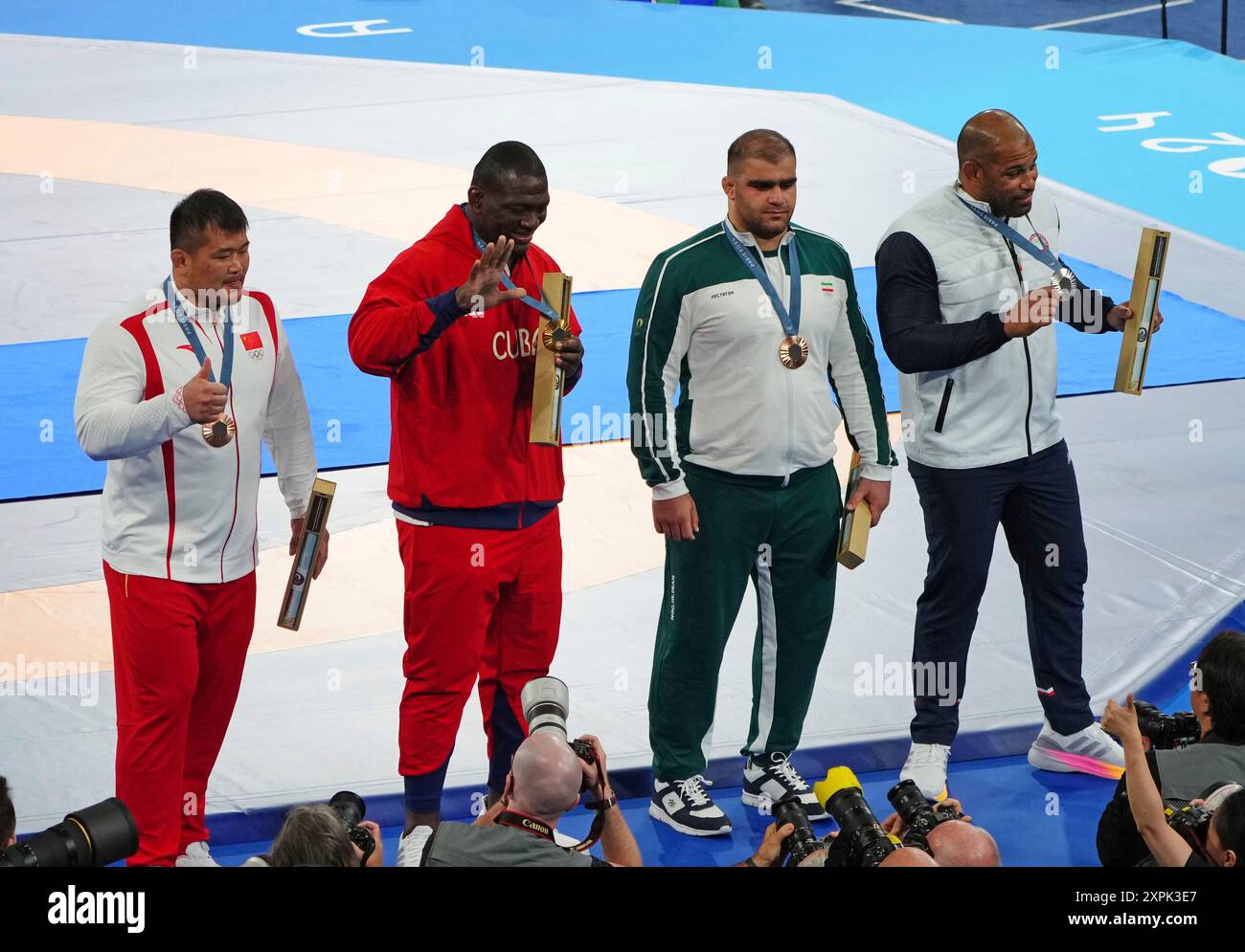 (L to R) Chile's ACOSTA FERNANDEZ Yasmani, silver, Cuba's LOPEZ NUNEZ Mijain, gold, Iran's ...