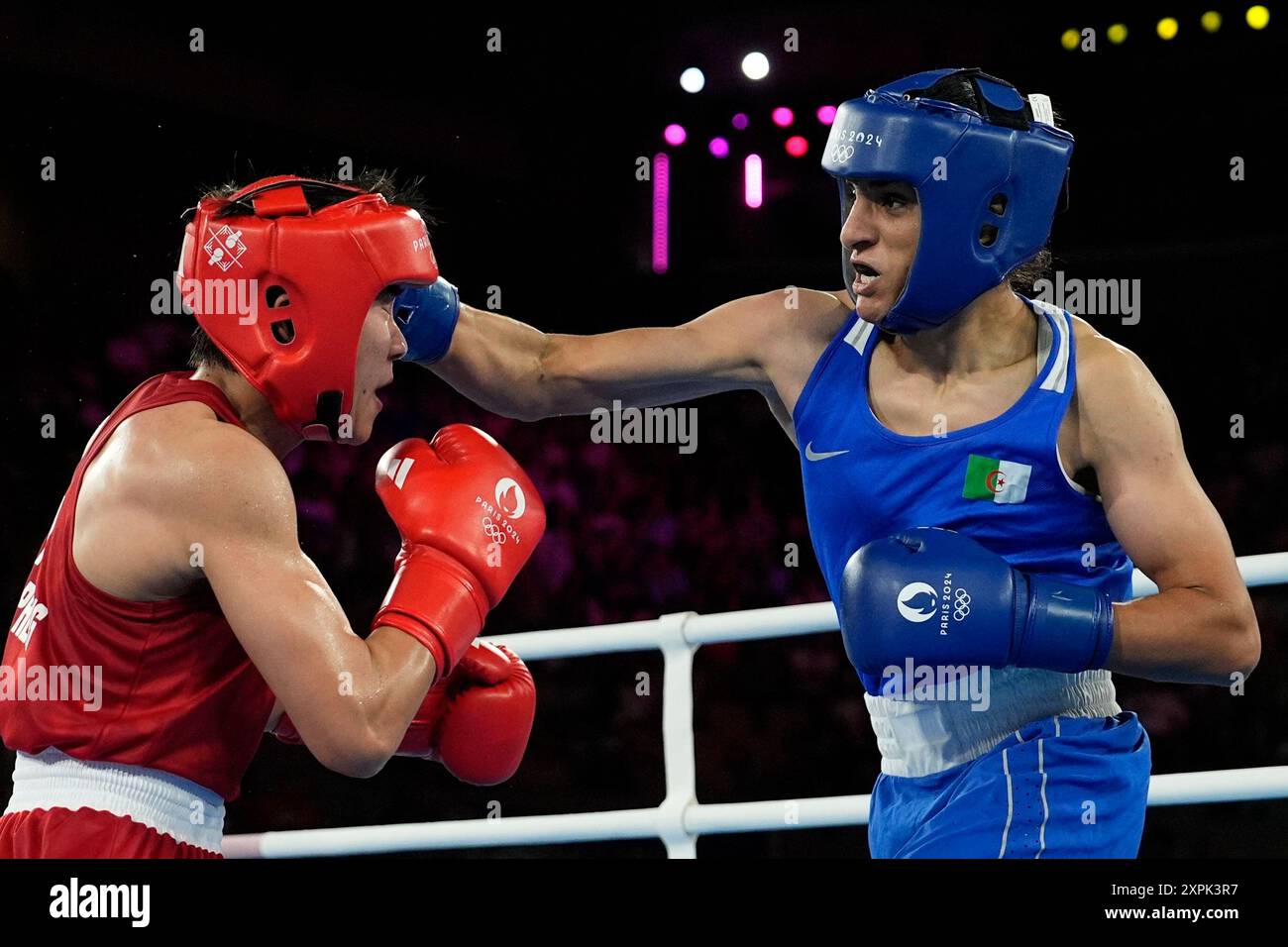 Thailand's Janjaem Suwannapheng, left, fights Algeria's Imane Khelif in ...