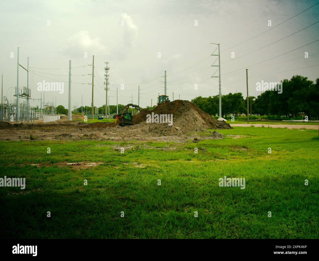 Construction brown dirt piles, bulldozer moving piles of dirt in an ...