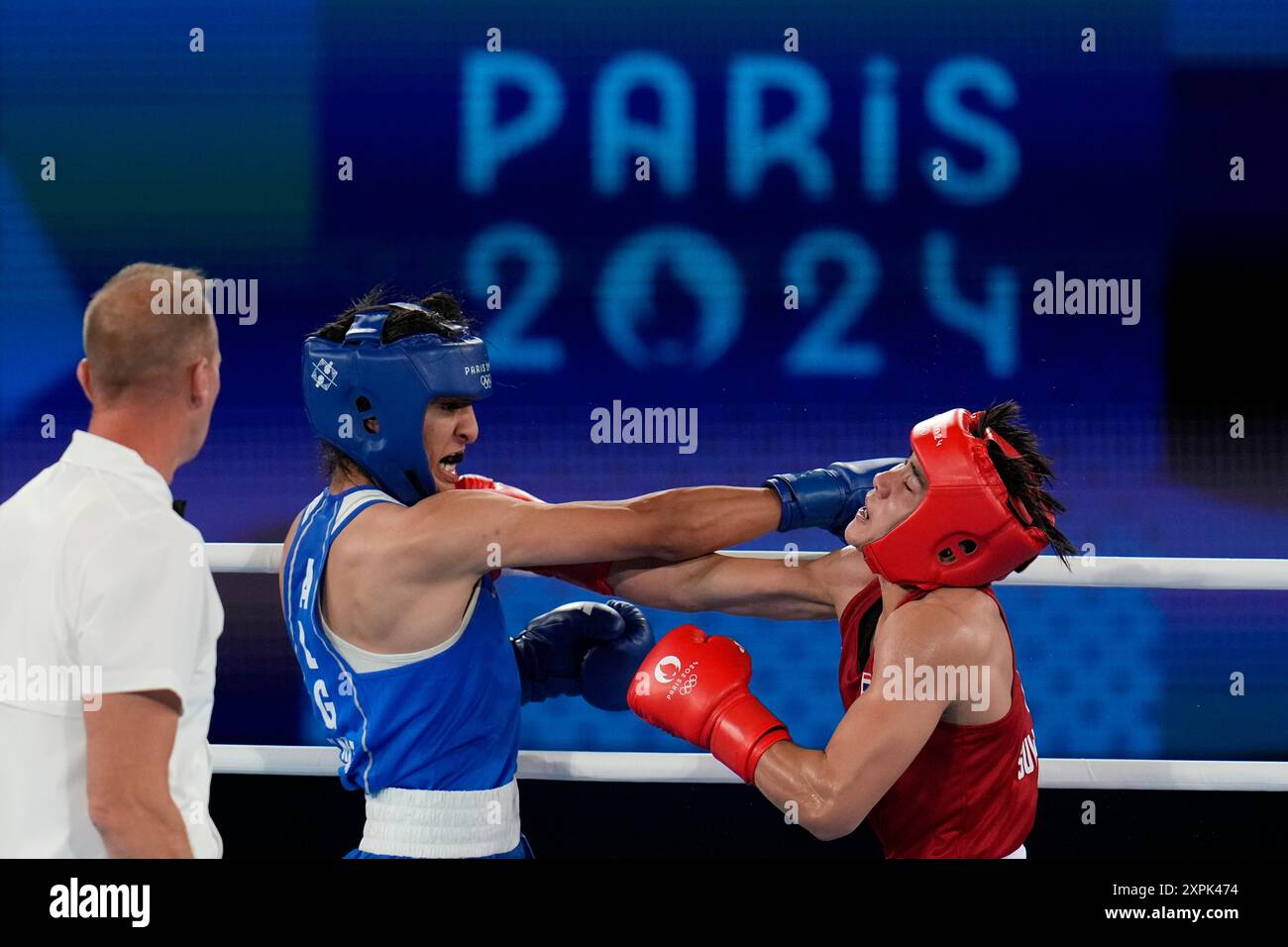 Thailand's Janjaem Suwannapheng, right, fights Algeria's Imane Khelif ...