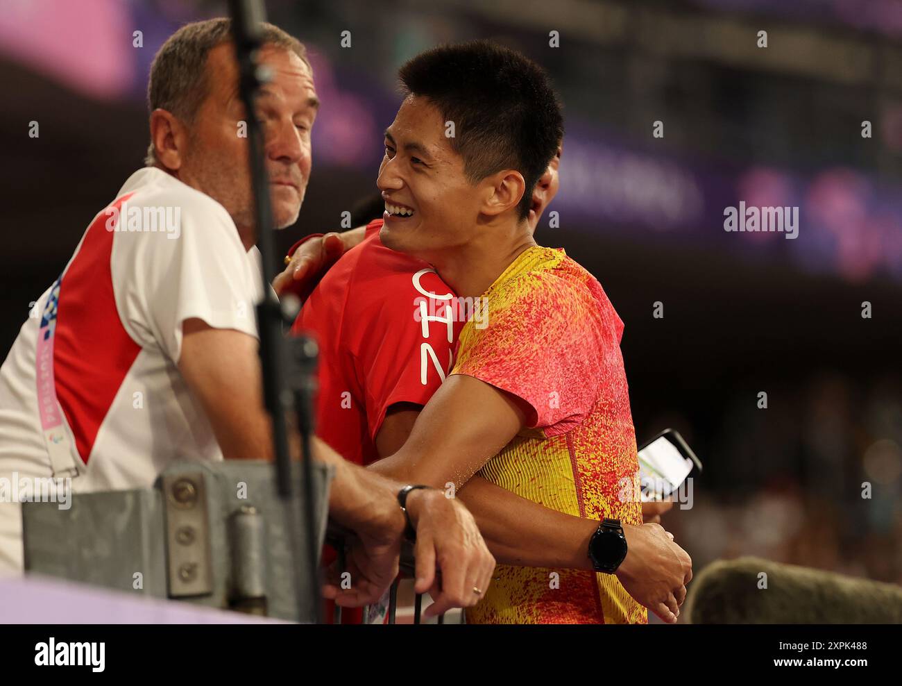 Paris, France. 6th Aug, 2024. Zhang Mingkun (R) of China reacts after the men's long jump final ...