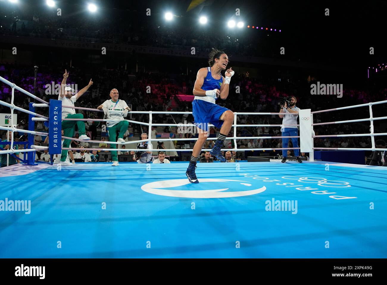 Algeria's Imane Khelif celebrates after defeating Thailand's Janjaem ...