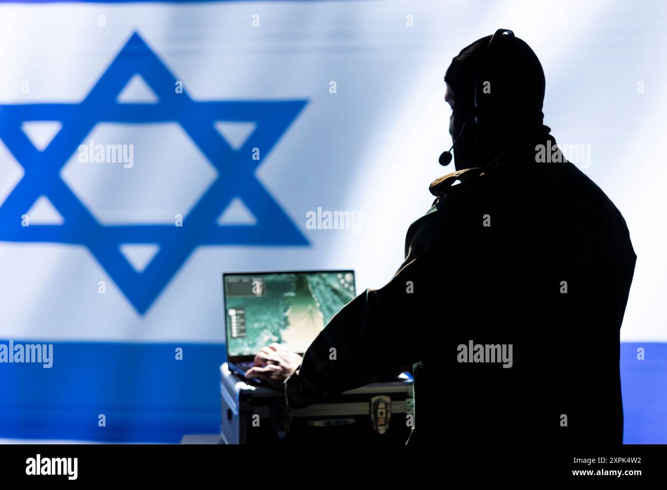 Mossad operative dispatcher talks in headphones mic, relaying ...