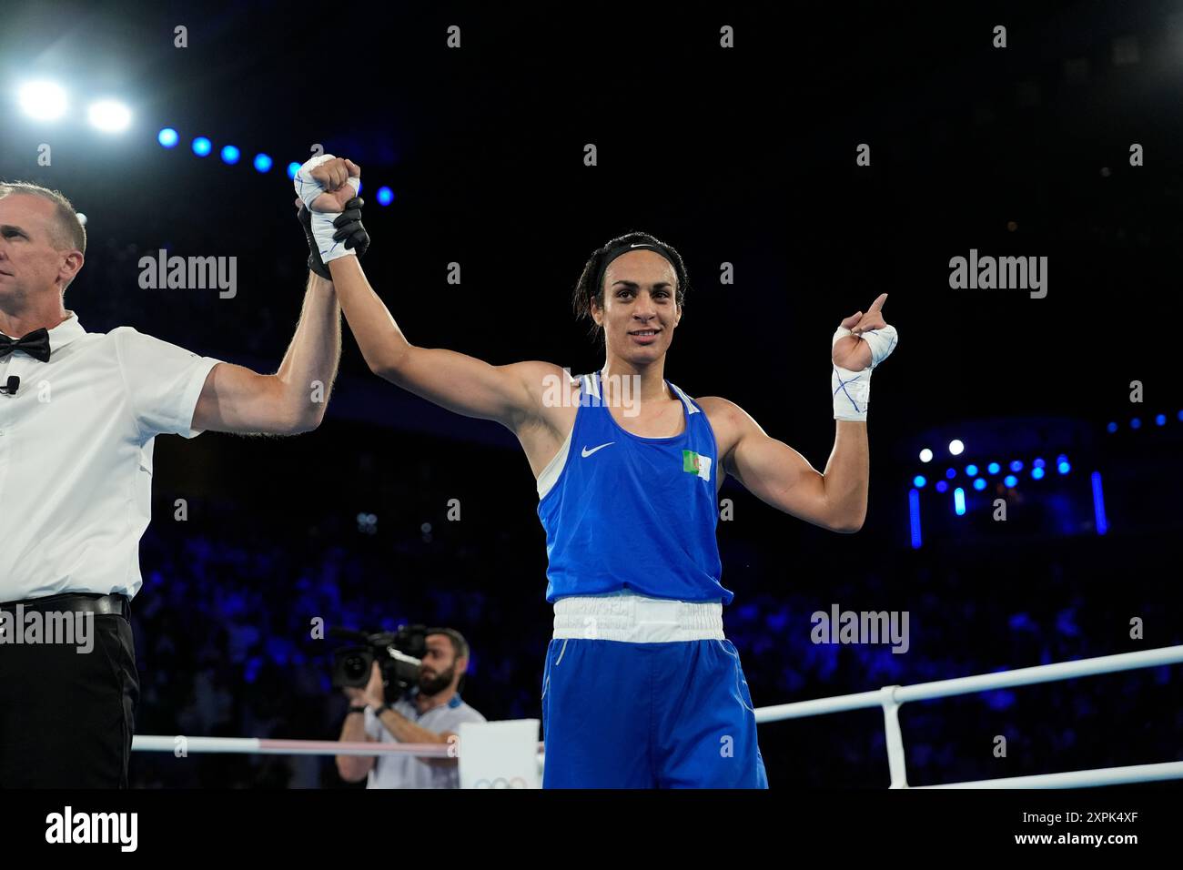 Algeria's Imane Khelif celebrates after defeating Thailand's Janjaem ...