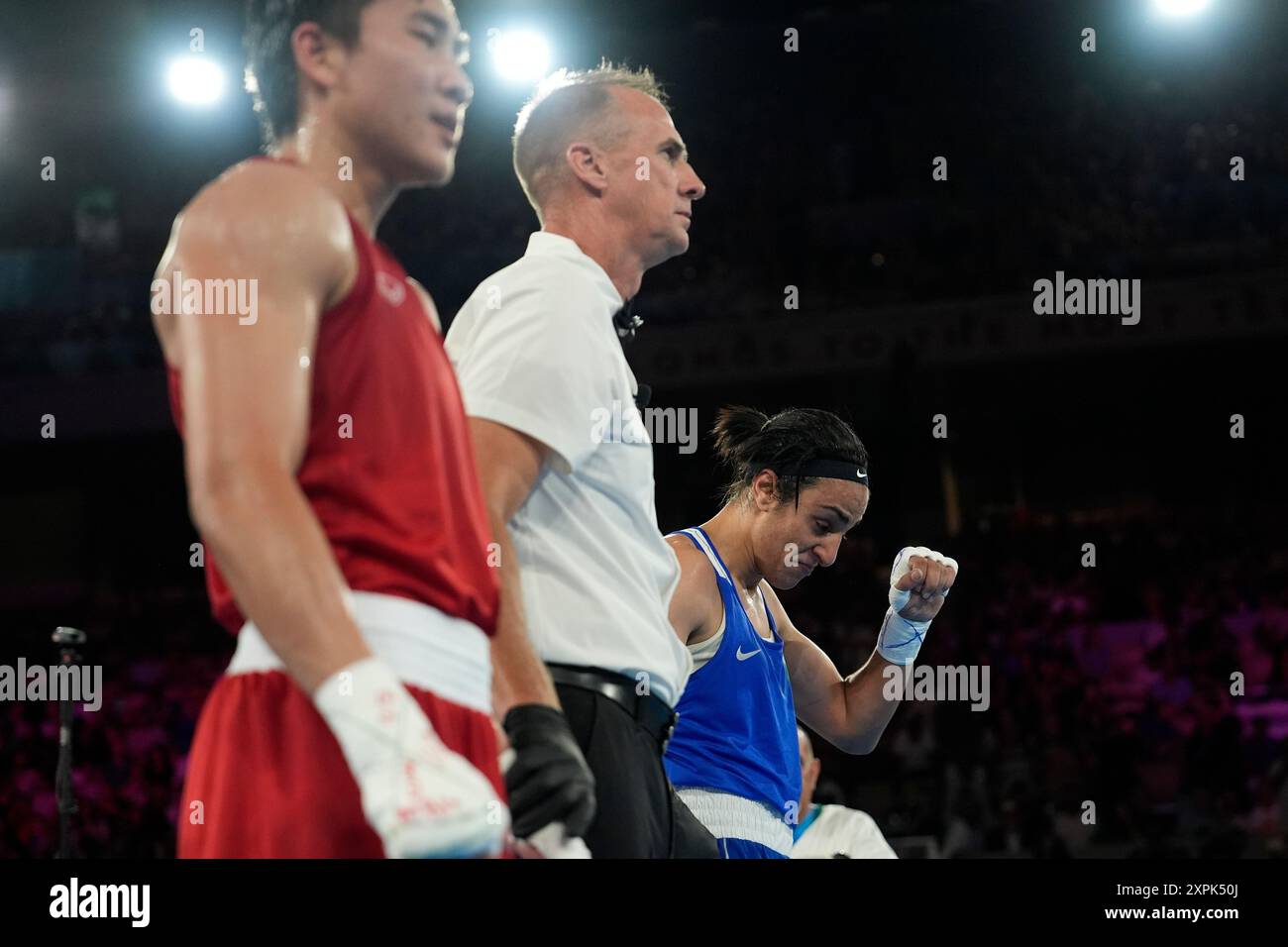 Algeria's Imane Khelif celebrates after defeating Thailand's Janjaem ...