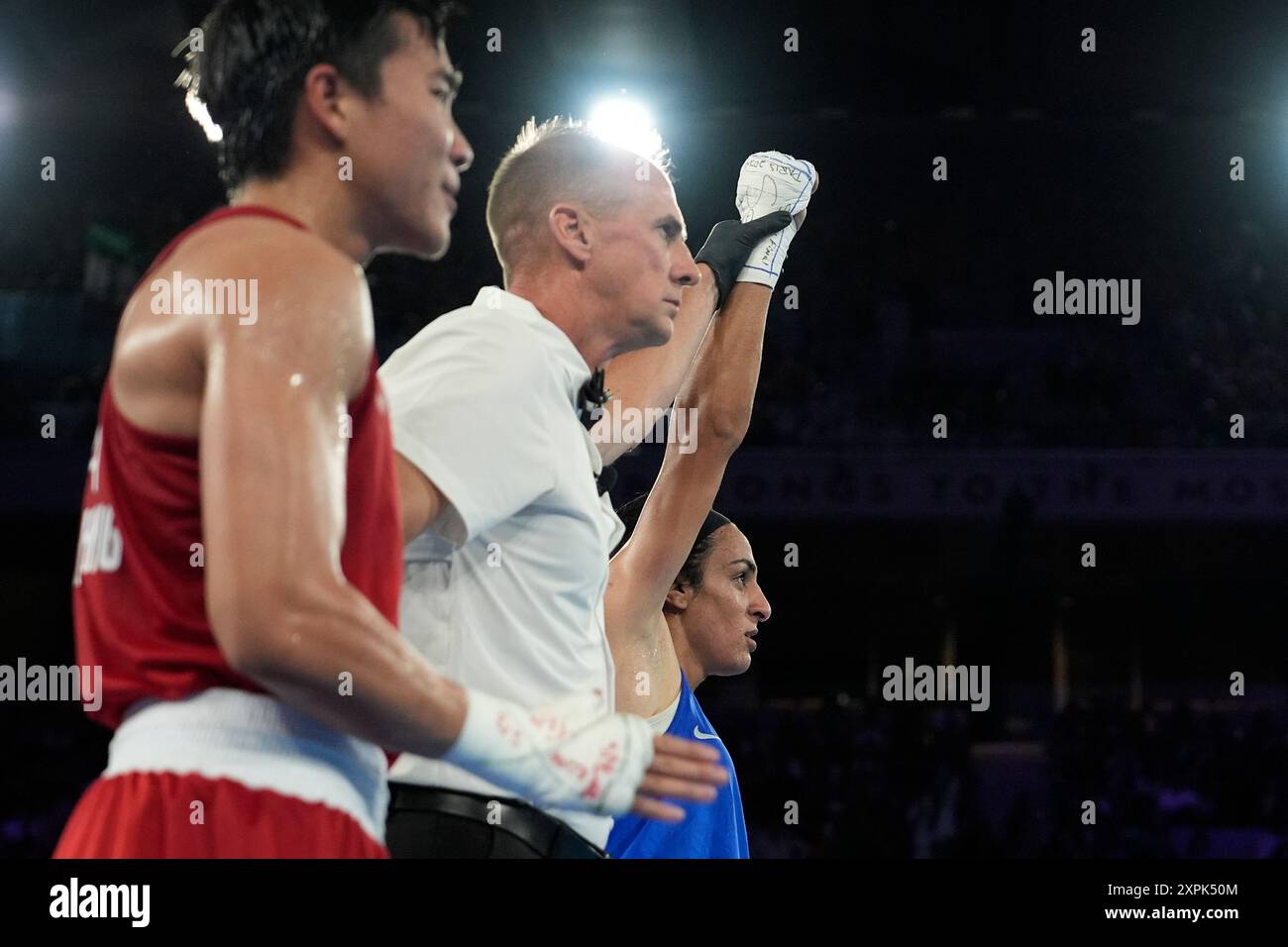 Algeria's Imane Khelif defeats Thailand's Janjaem Suwannapheng, left ...