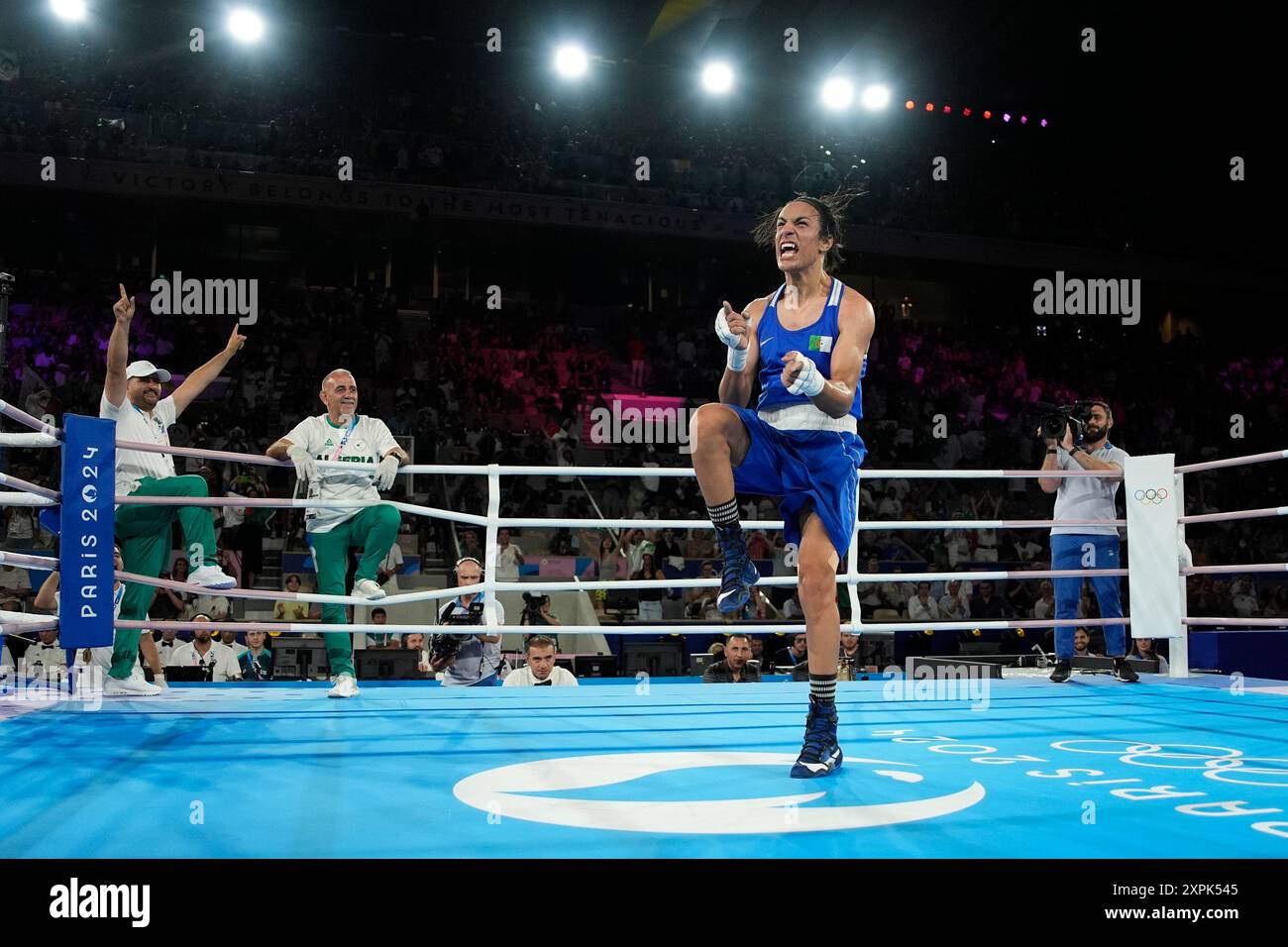 Algeria's Imane Khelif celebrates after defeating Thailand's Janjaem ...