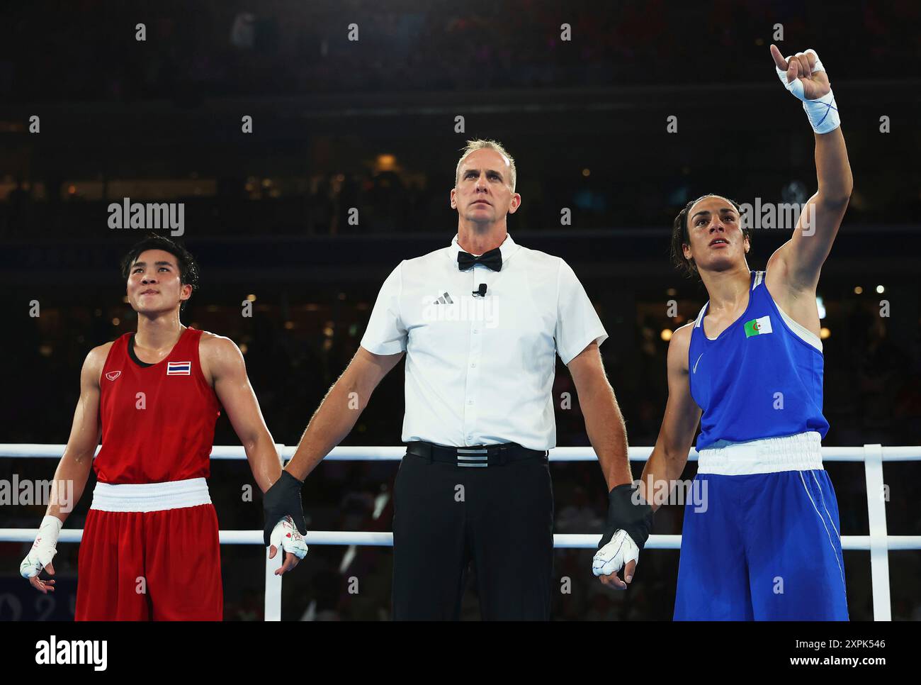 Janjaem Suwannapheng of Thailand, left, looks on after Match Referee ...