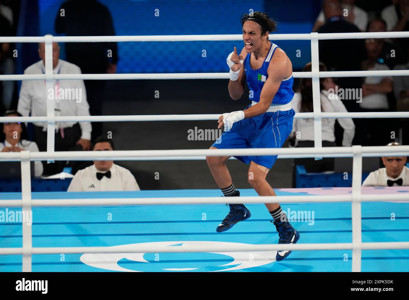 Algeria's Imane Khelif celebrates after defeating Thailand's Janjaem ...