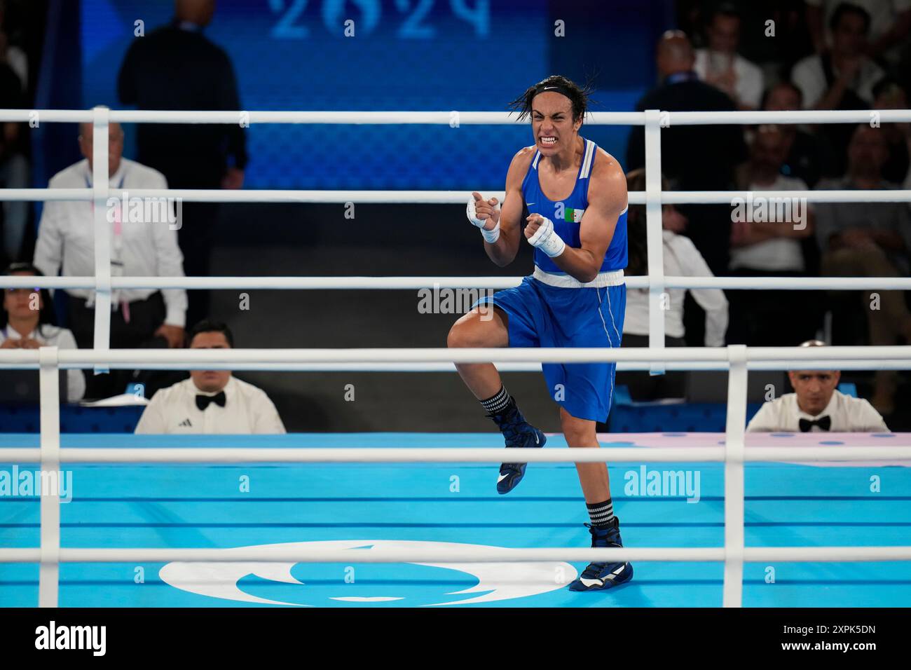 Algeria's Imane Khelif celebrates after defeating Thailand's Janjaem ...