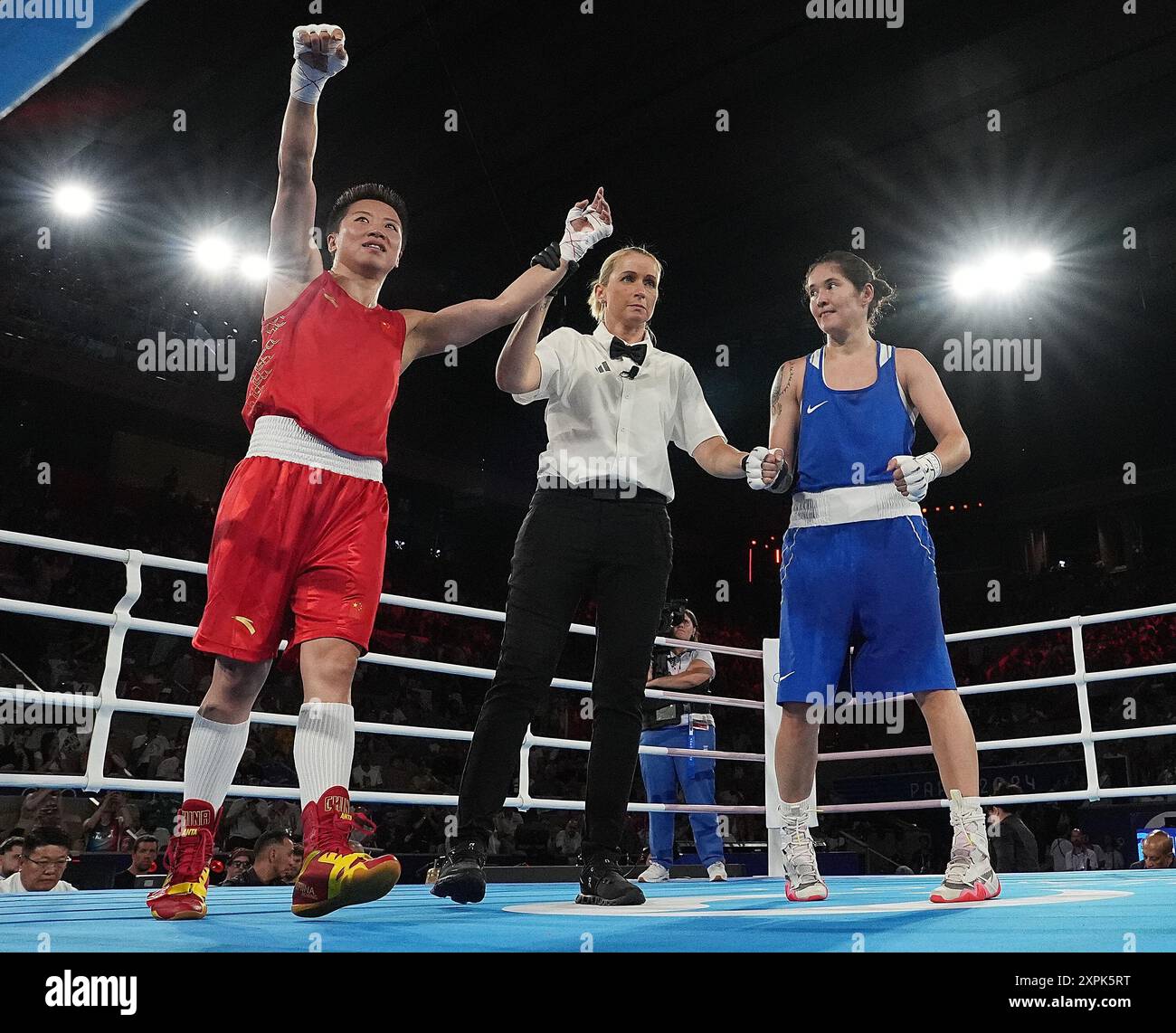 Paris, France. 6th Aug, 2024. Wu Yu (L) of China has her hand raised ...