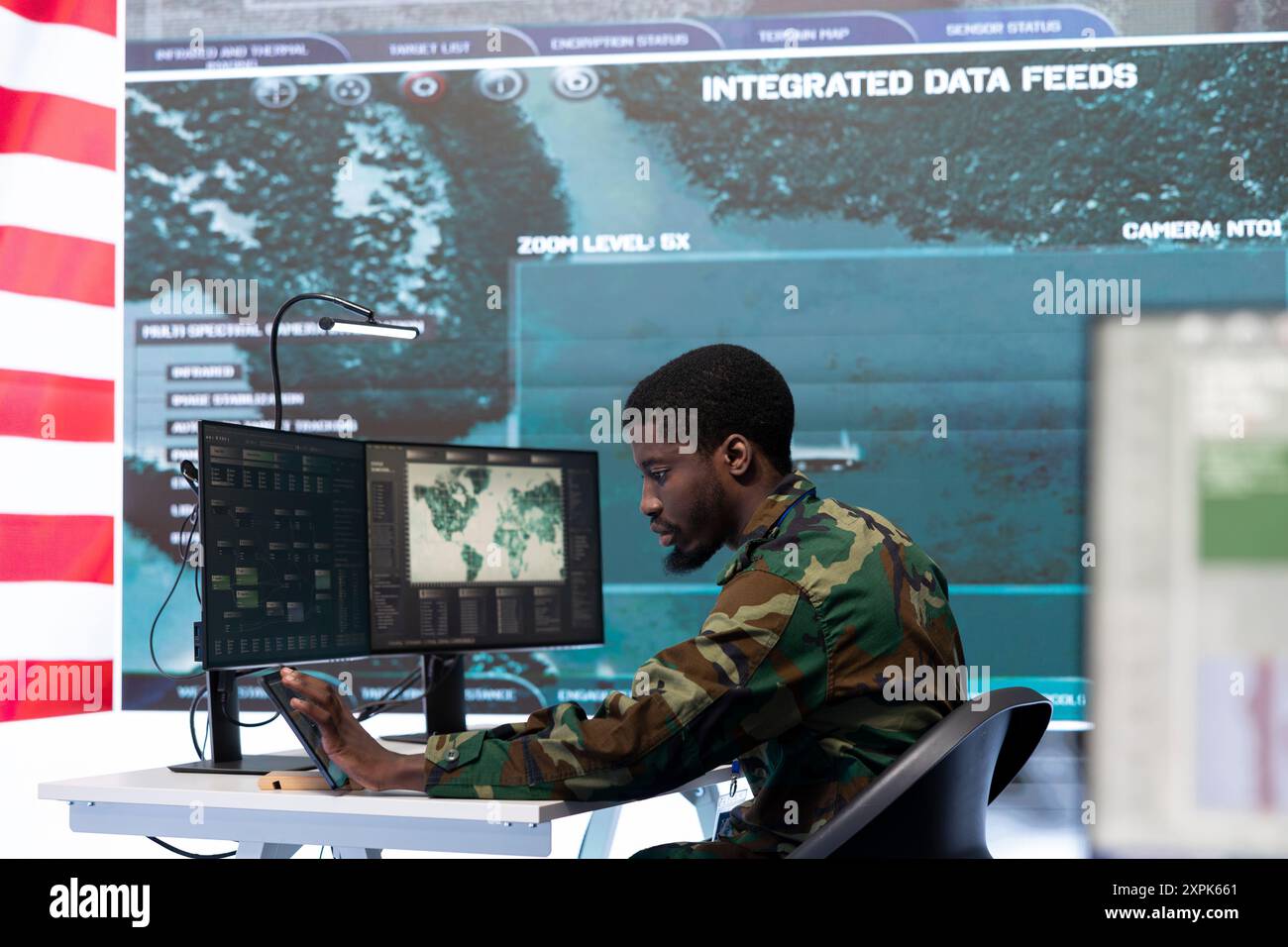 American military officer works in a high tech command post, managing national safety operations ...