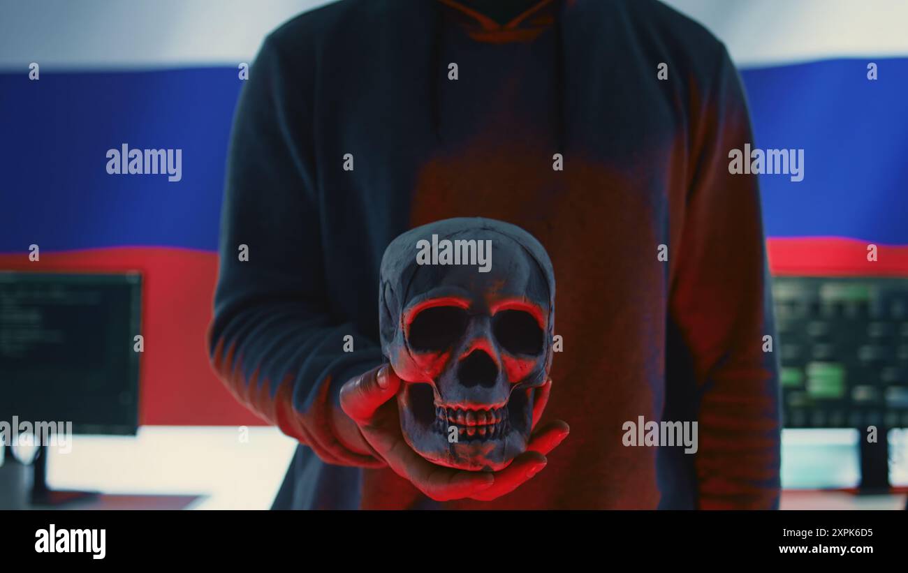 A maniacal russian hacker creating cyber threat alert by holding a ...