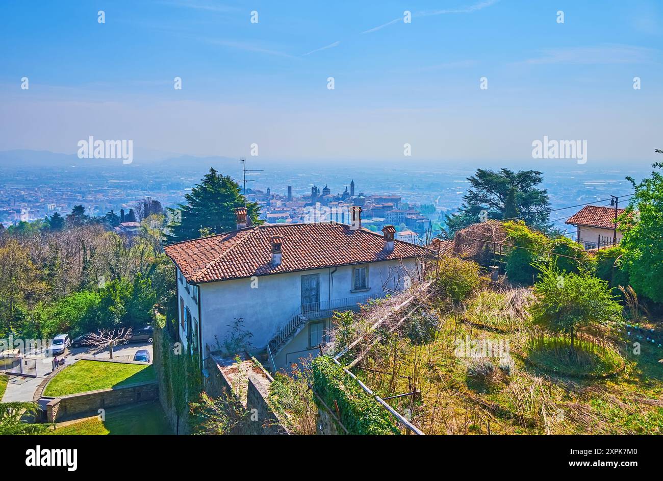 The silhouette of towers and roofs of Bergamo Alta (upper town) from ...