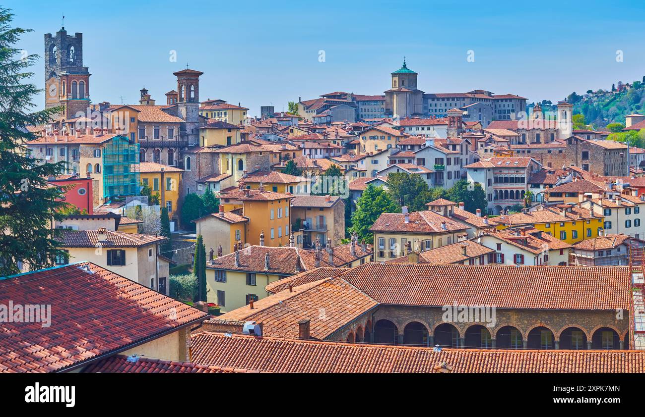 The medieval towers of the Citta Alta (Upper Town) behind the red tile ...