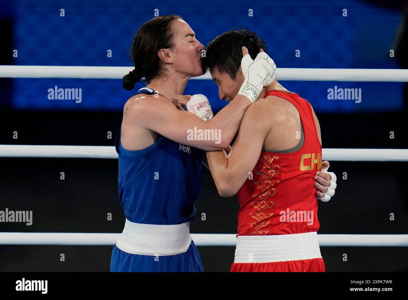 Ireland's Kellie Harrington embraces China's Yang Wenlu, right, after ...