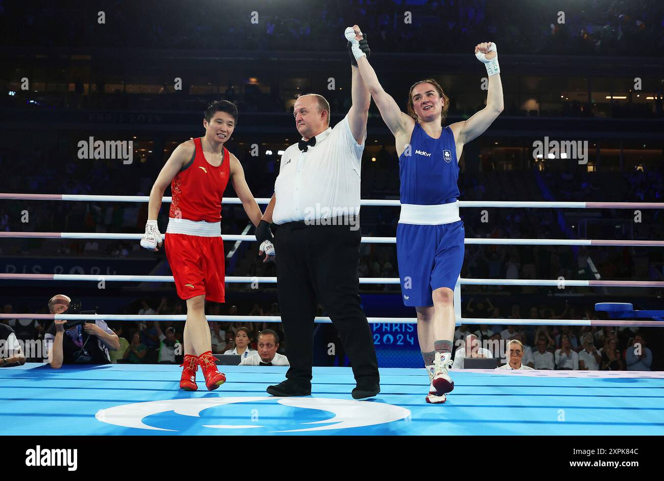 Ireland's Kellie Harrington, right, is declared the winner over China's ...