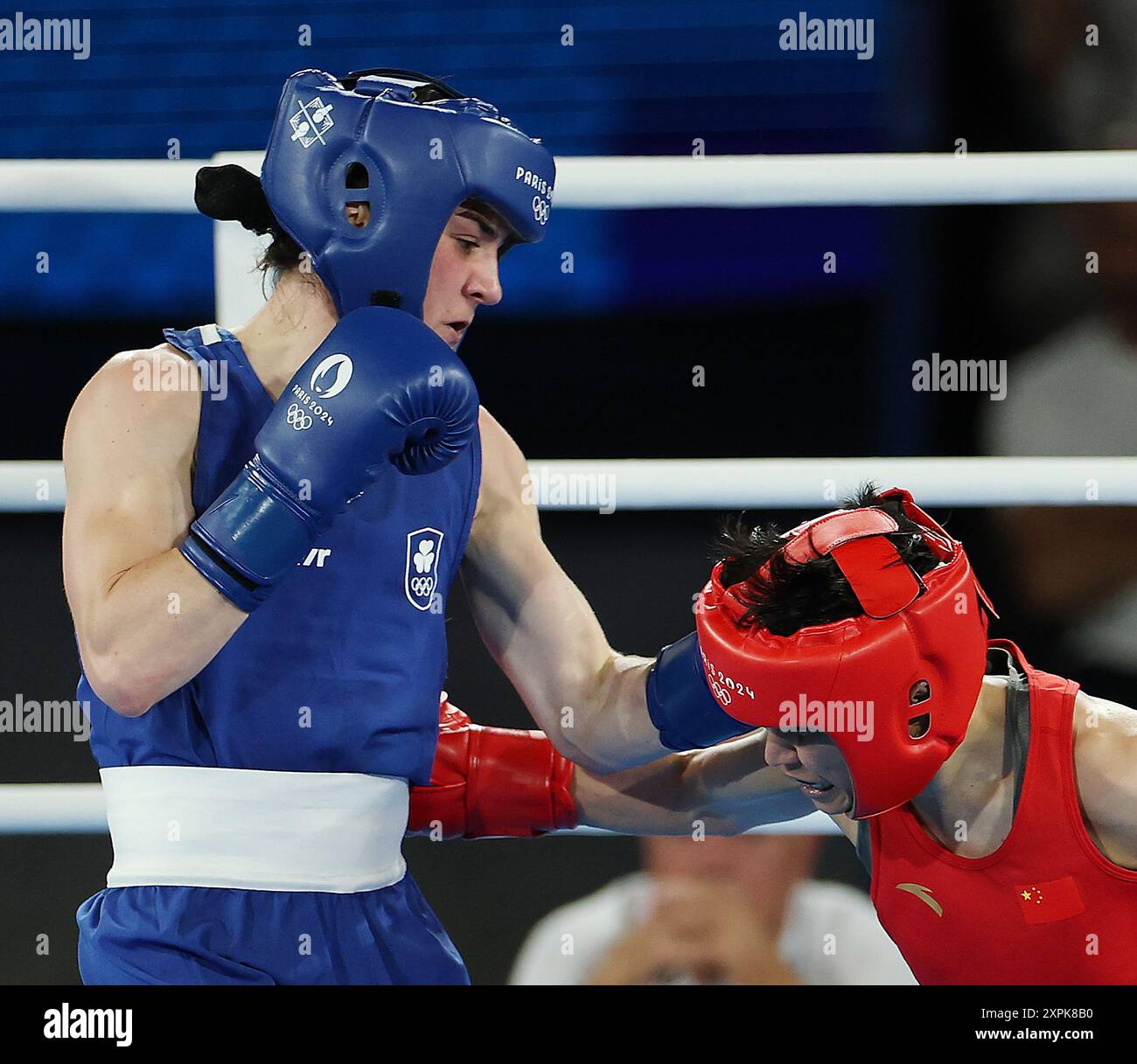 Paris, France. 6th Aug, 2024. Yang Wenlu (R) of China competes with ...