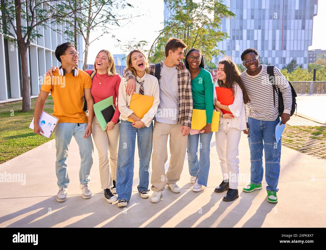 Group generation z international university students laughing standing ...