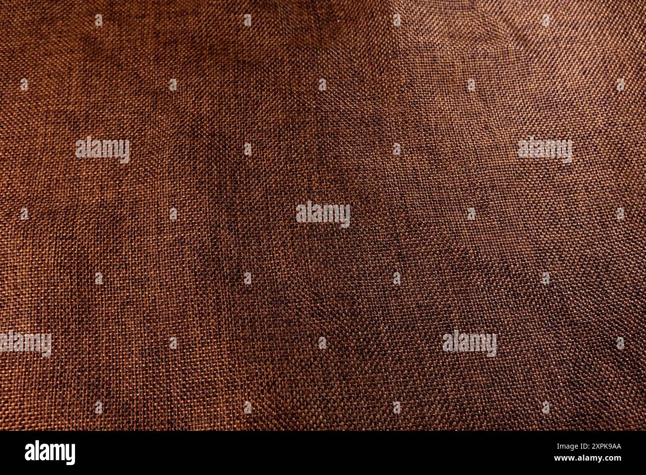 The backdrop showcases a beautifully woven brown cloth, revealing its ...