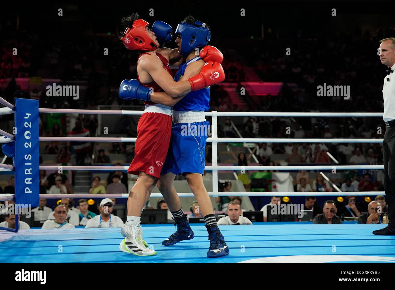 Thailand's Janjaem Suwannapheng, left, fights Algeria's Imane Khelif in ...