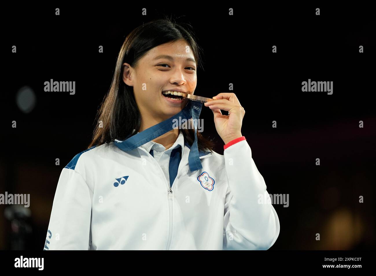 Bronze medalists Taiwan's Wu Shih-Yi poses on the podium for the women's 60 kg final boxing at ...